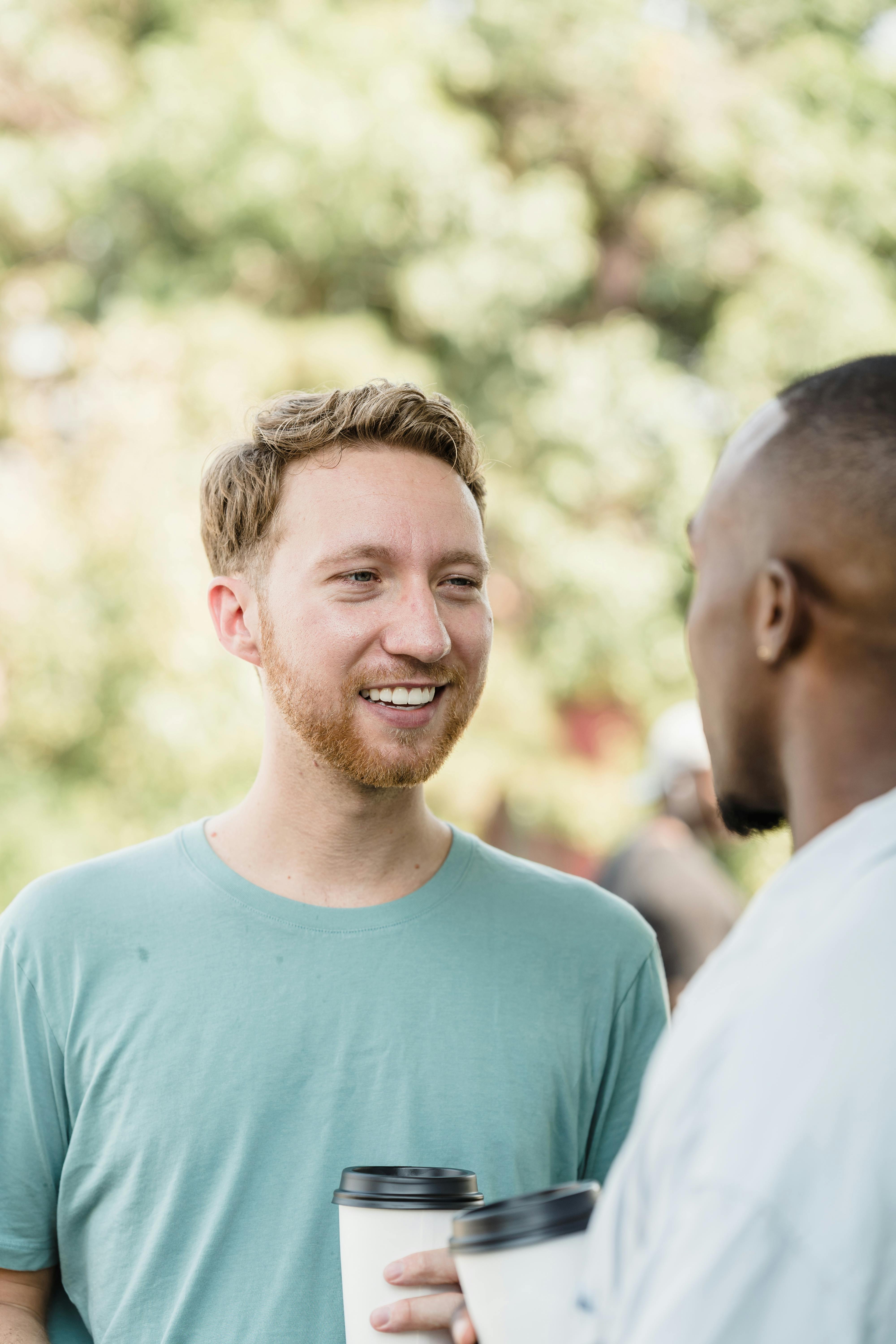 Man Smiling at another Man · Free Stock Photo