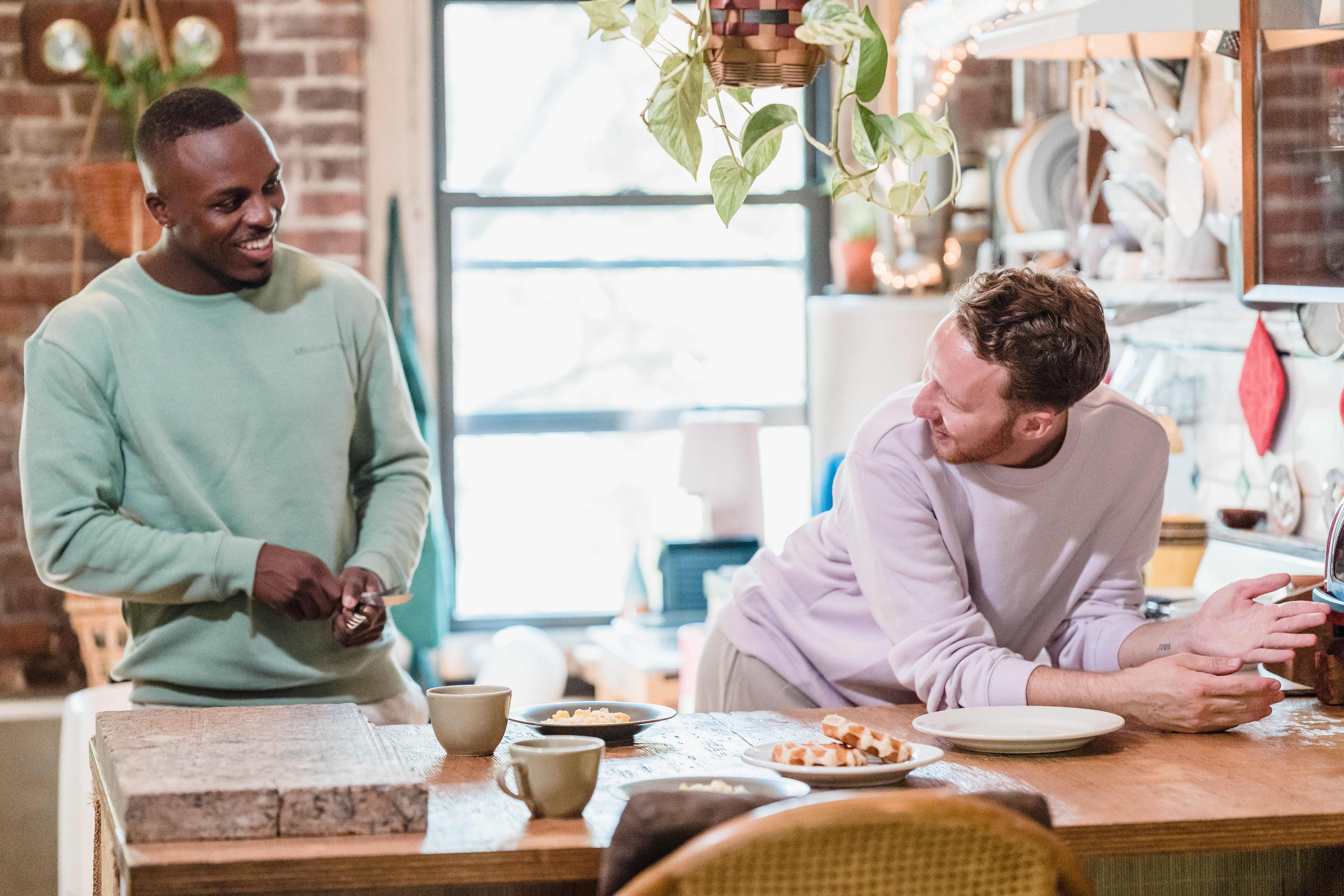 Smiling Men by Table · Free Stock Photo