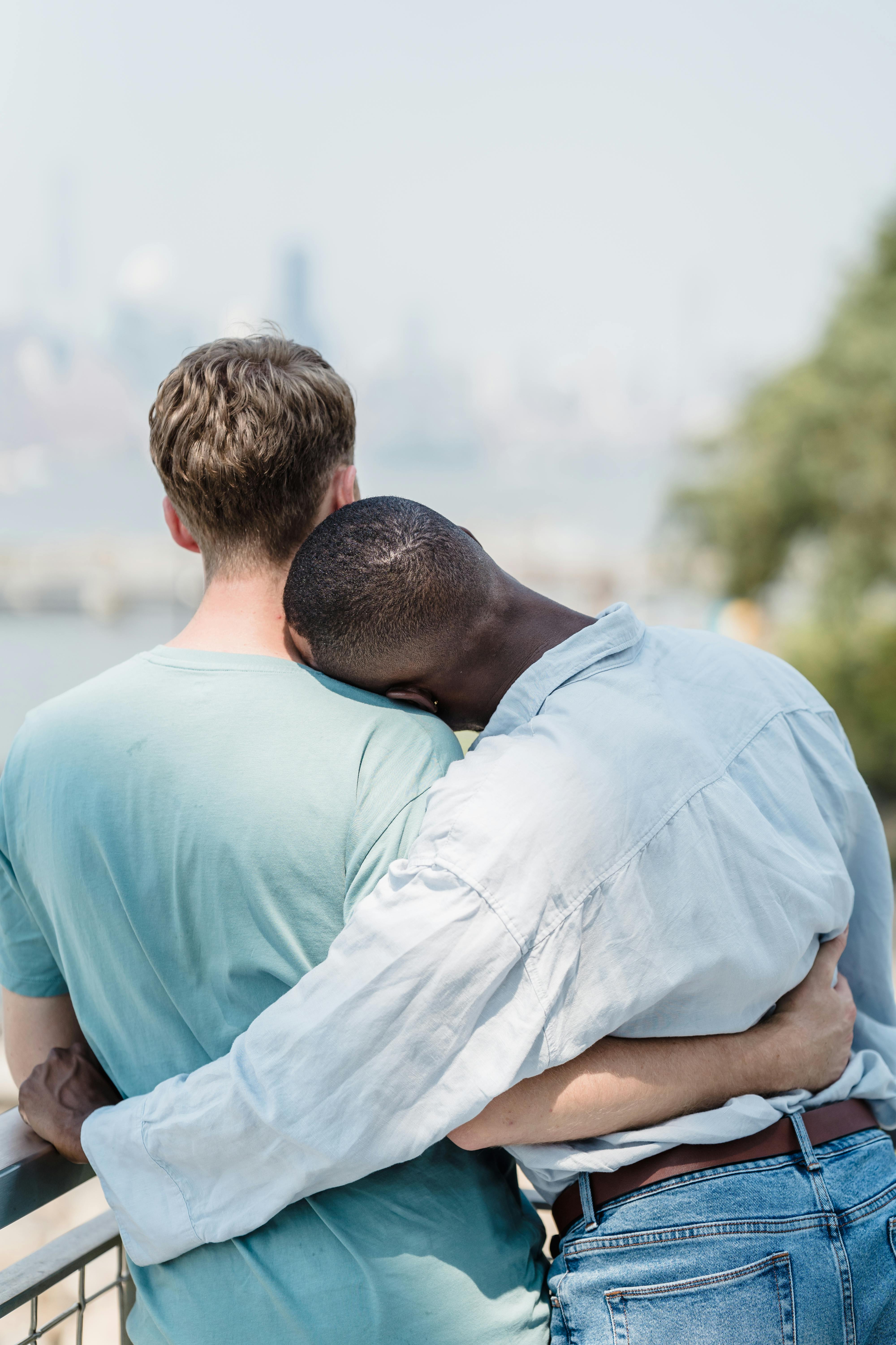 Men Standing and Hugging · Free Stock Photo