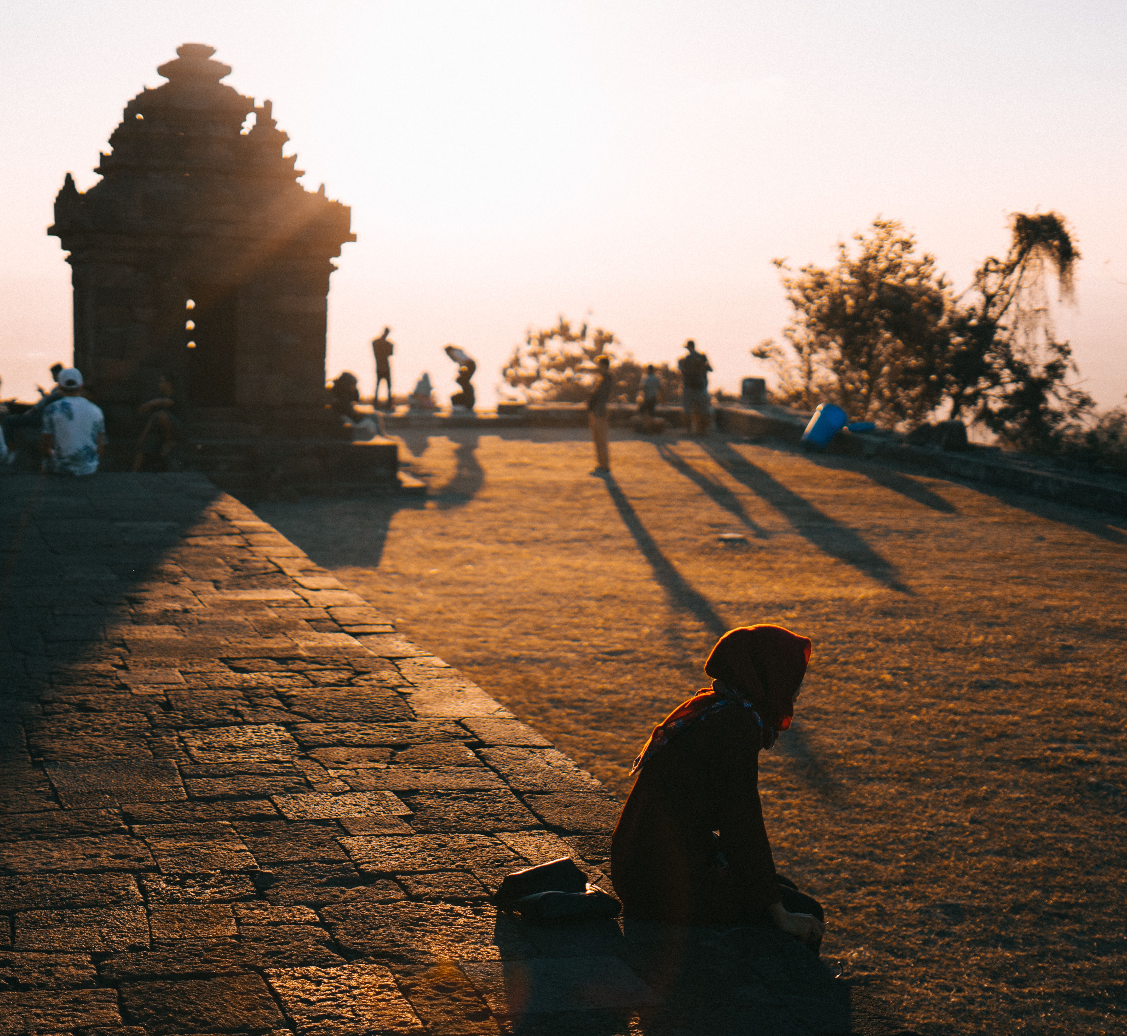 Person Sitting on Ground Outdoors · Free Stock Photo