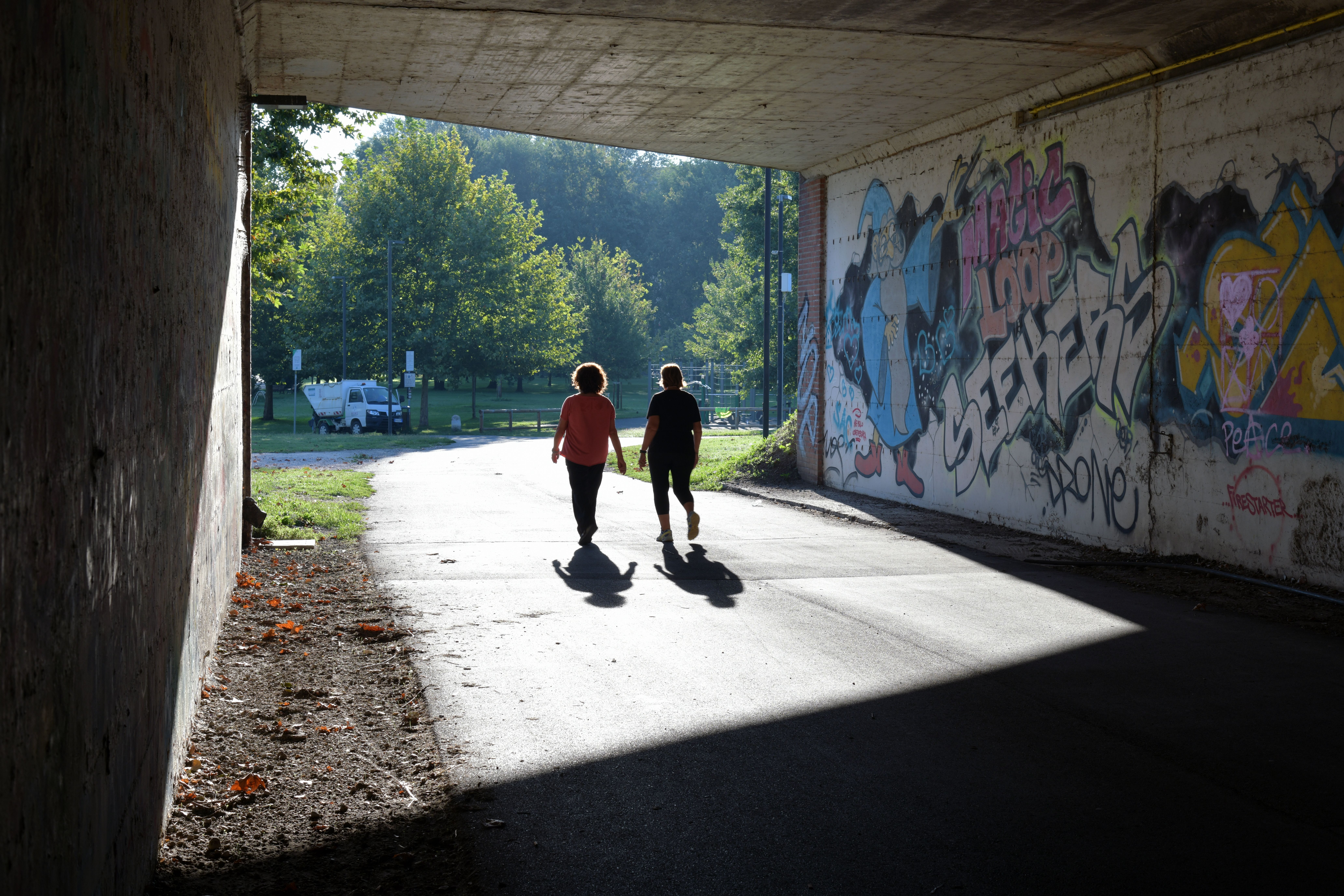 Women Walking Under a Bridge · Free Stock Photo