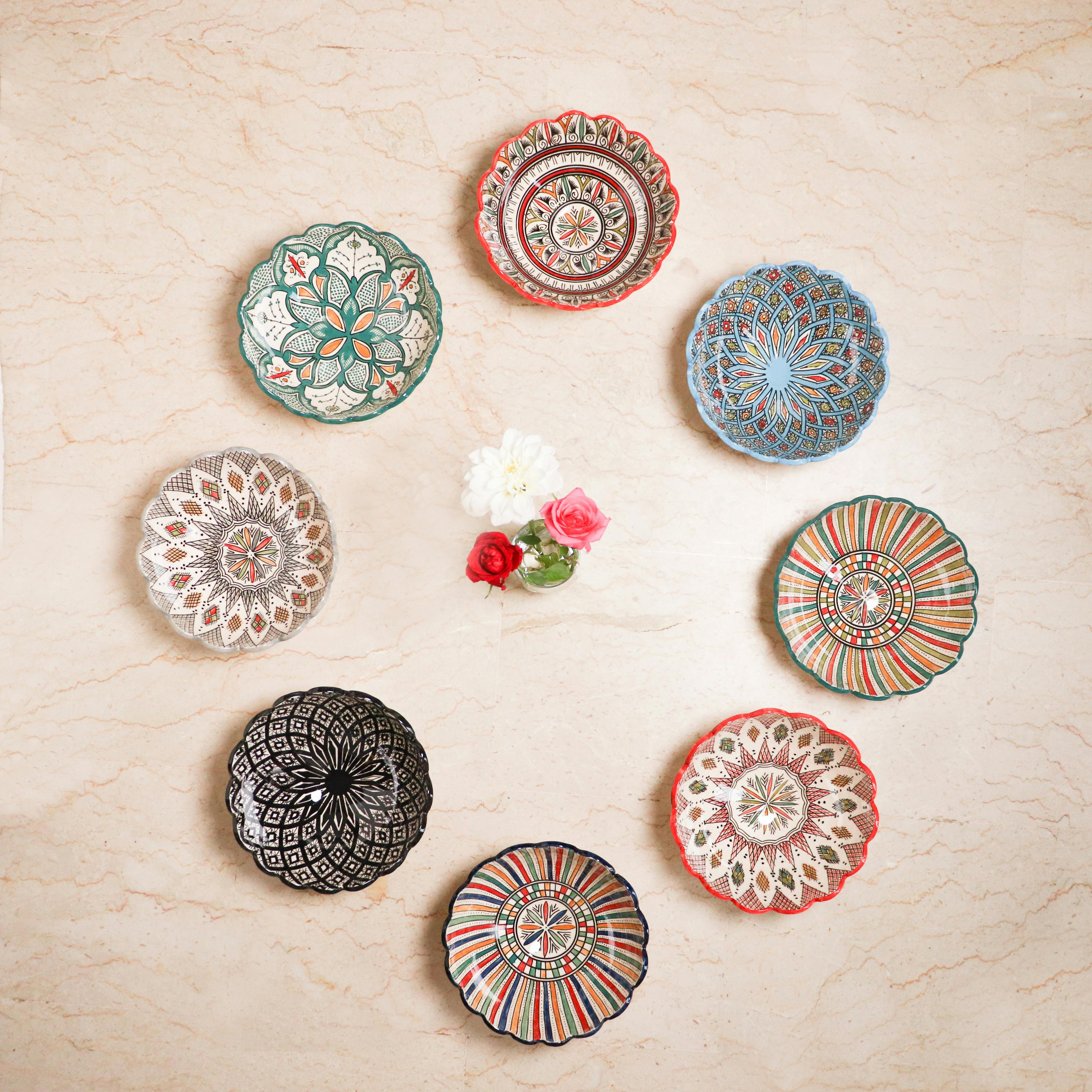 Colorful Ceramic Bowls around a Flower Vase · Free Stock Photo