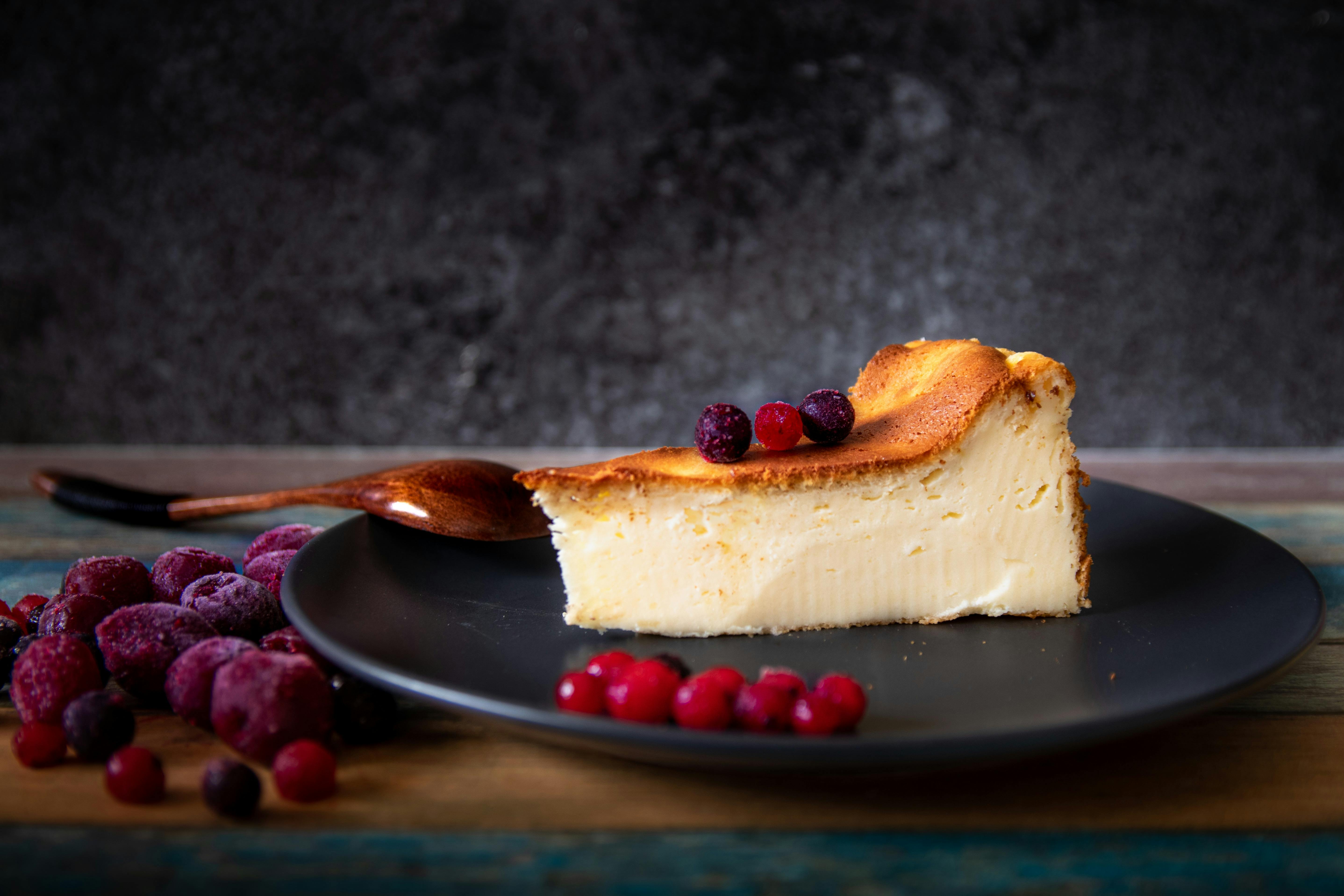 Overhead Shot of Cheesecake with Fruits Near Gold Spoons · Free Stock Photo