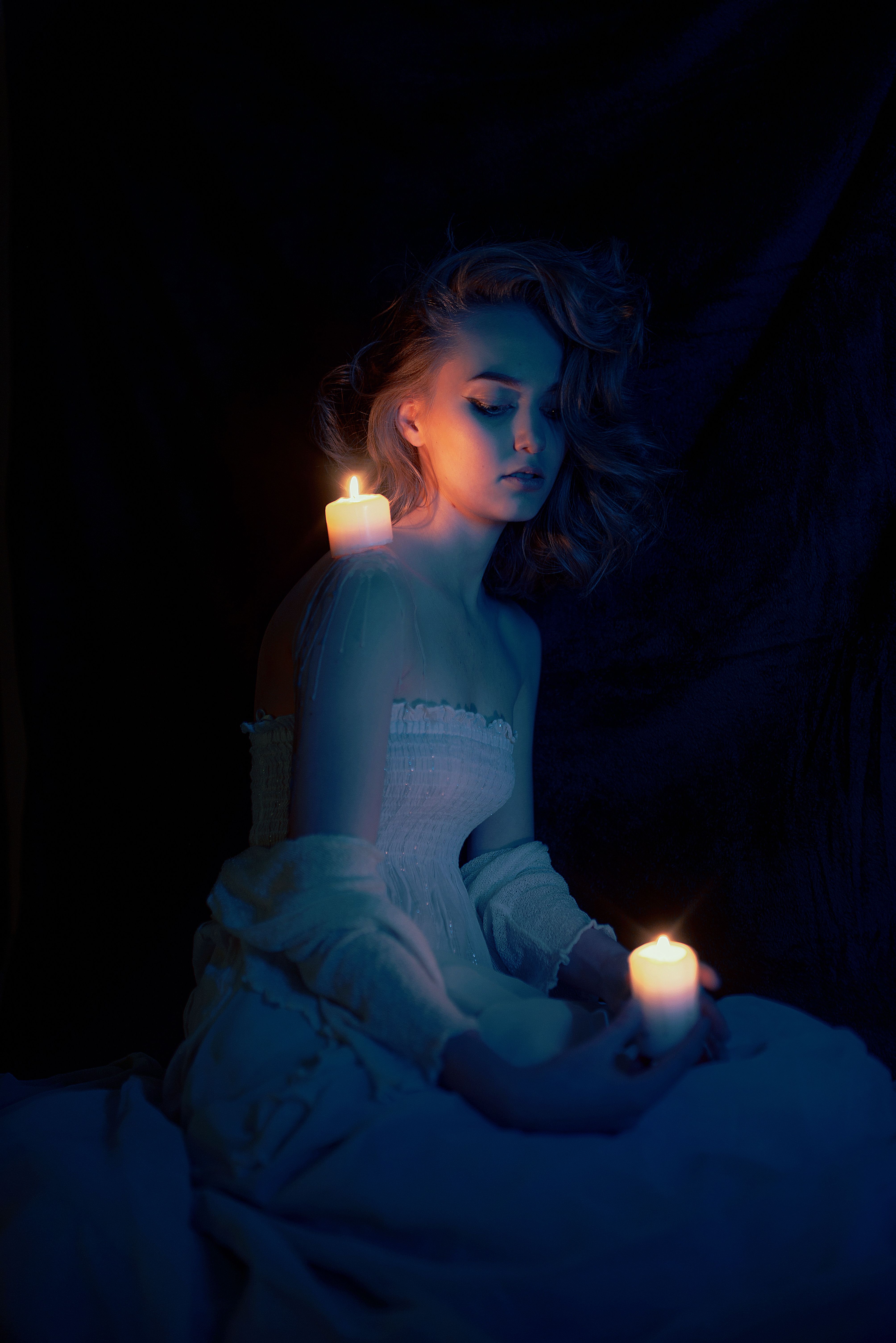 Graceful Woman holding a Lighted Candle · Free Stock Photo