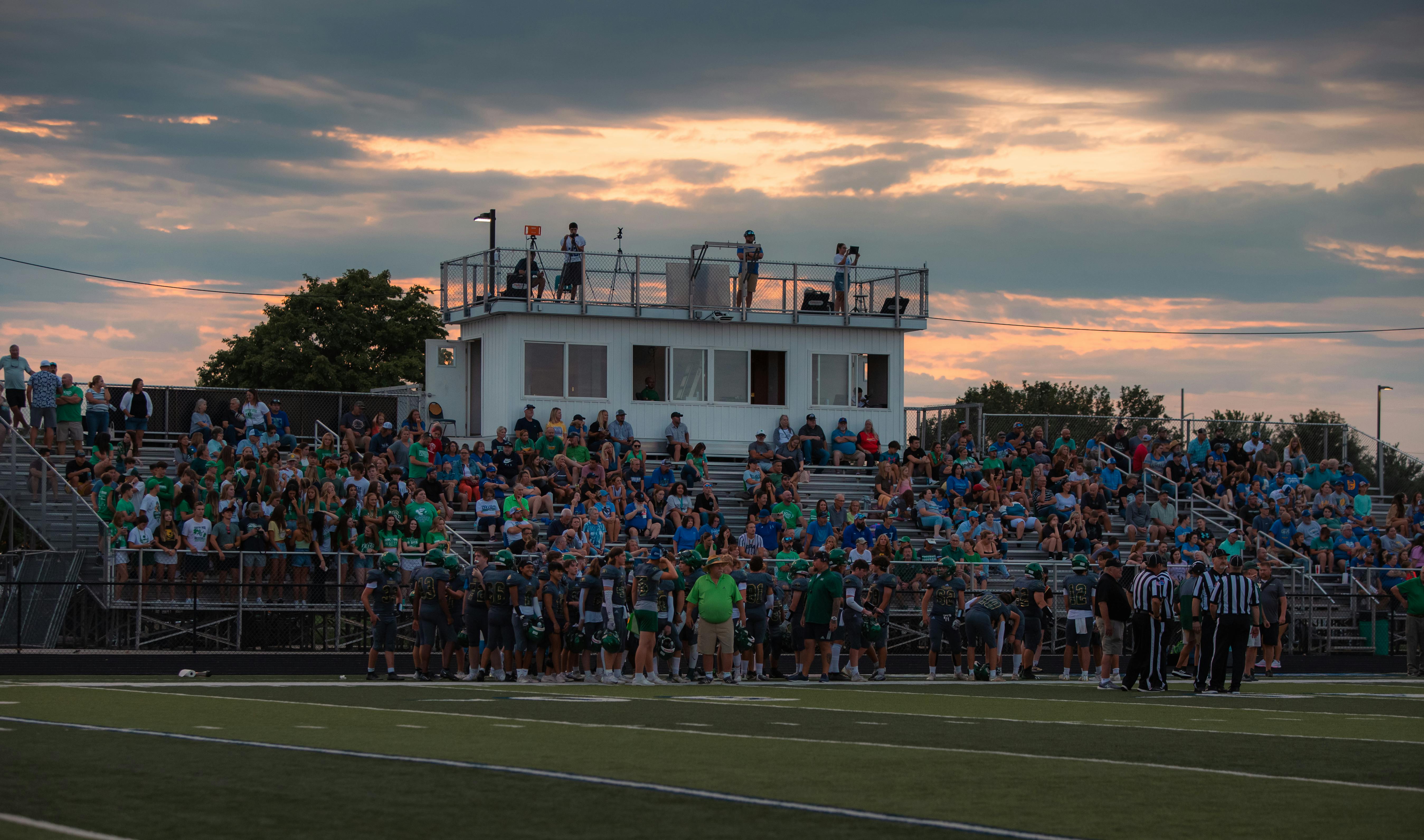Football Fans Lighting up Green Smoke Flare · Free Stock Photo