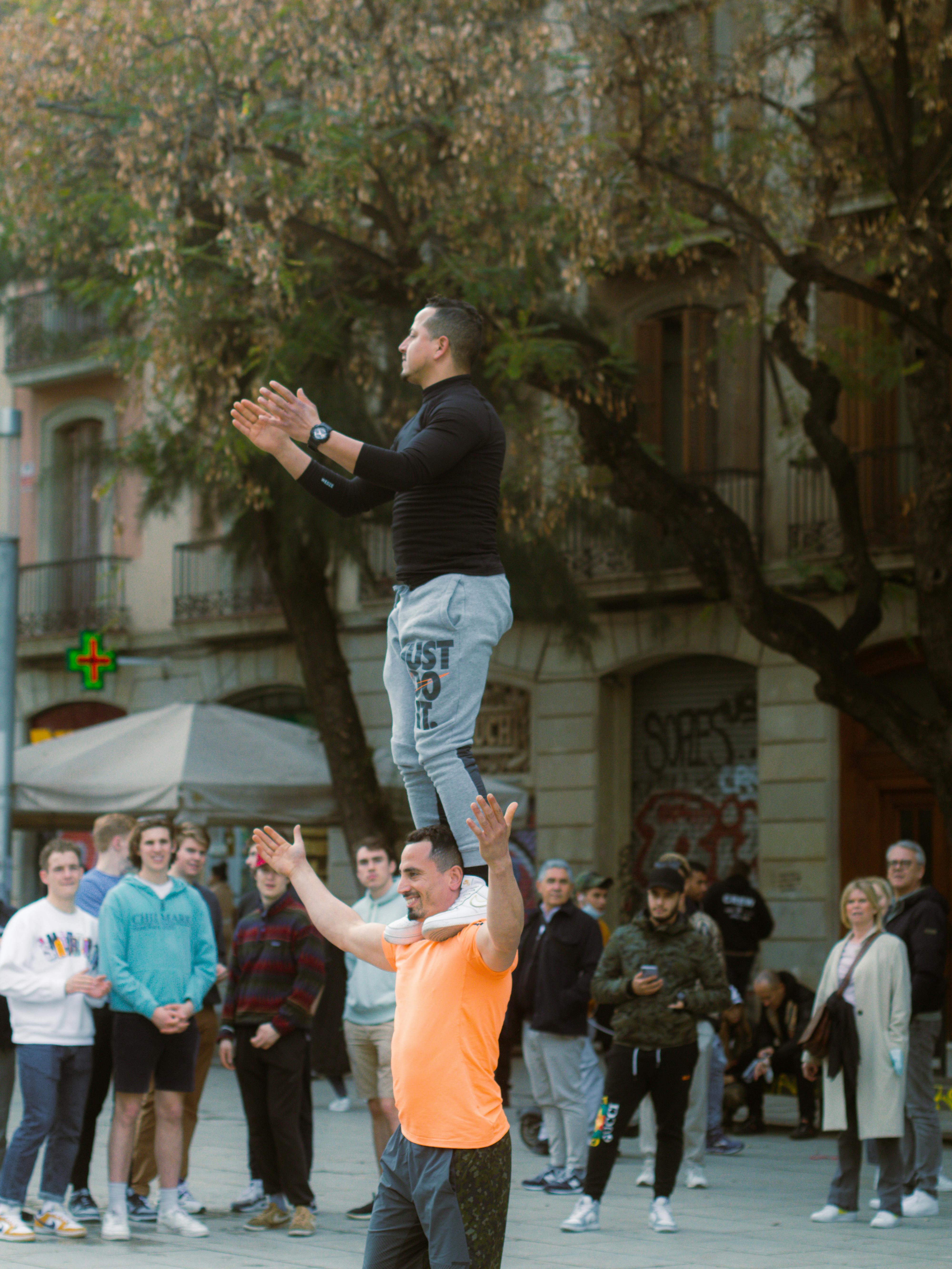People Watching Man Balancing · Free Stock Photo