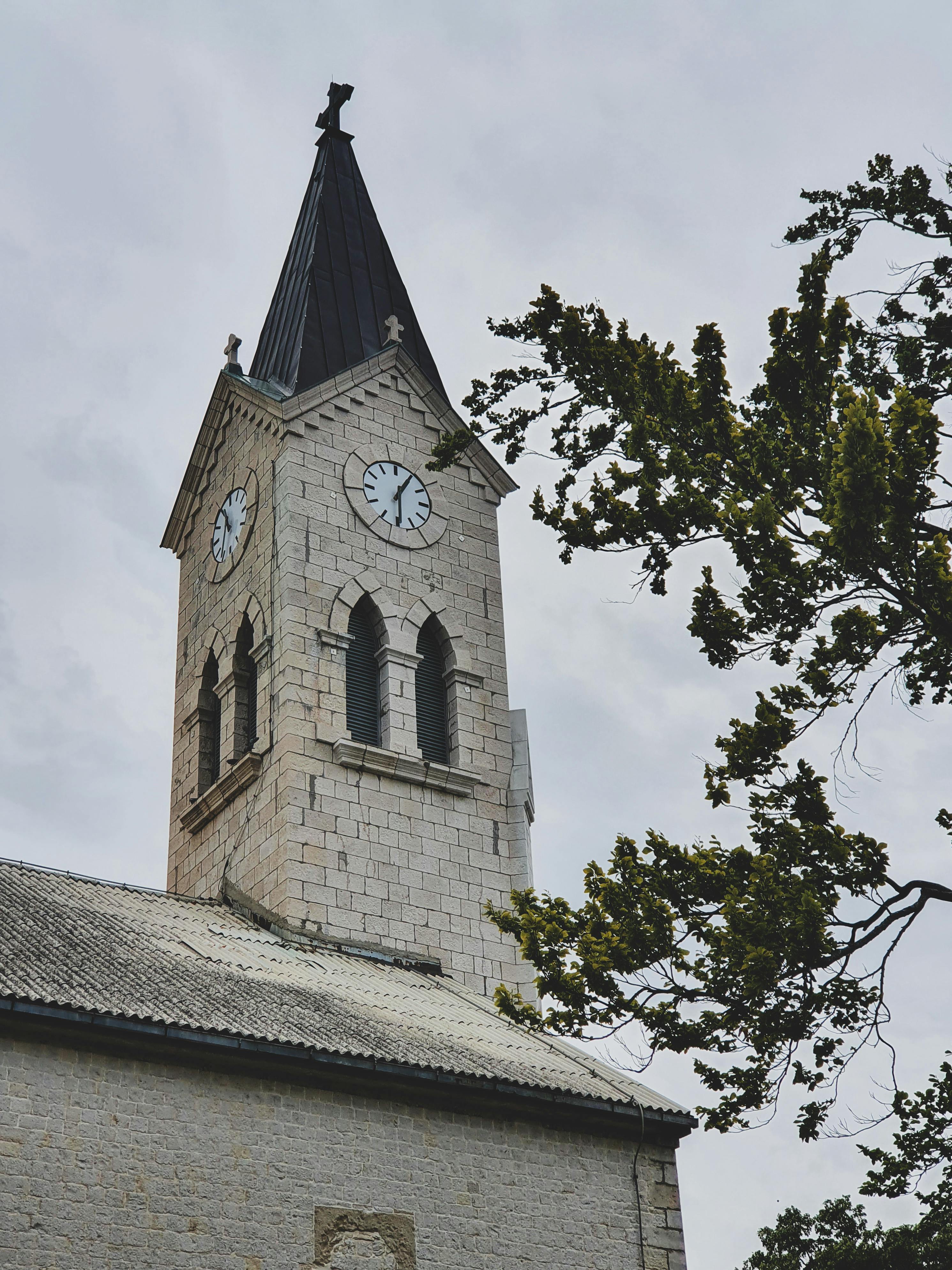 Brown Church Building Under Gray Sky · Free Stock Photo