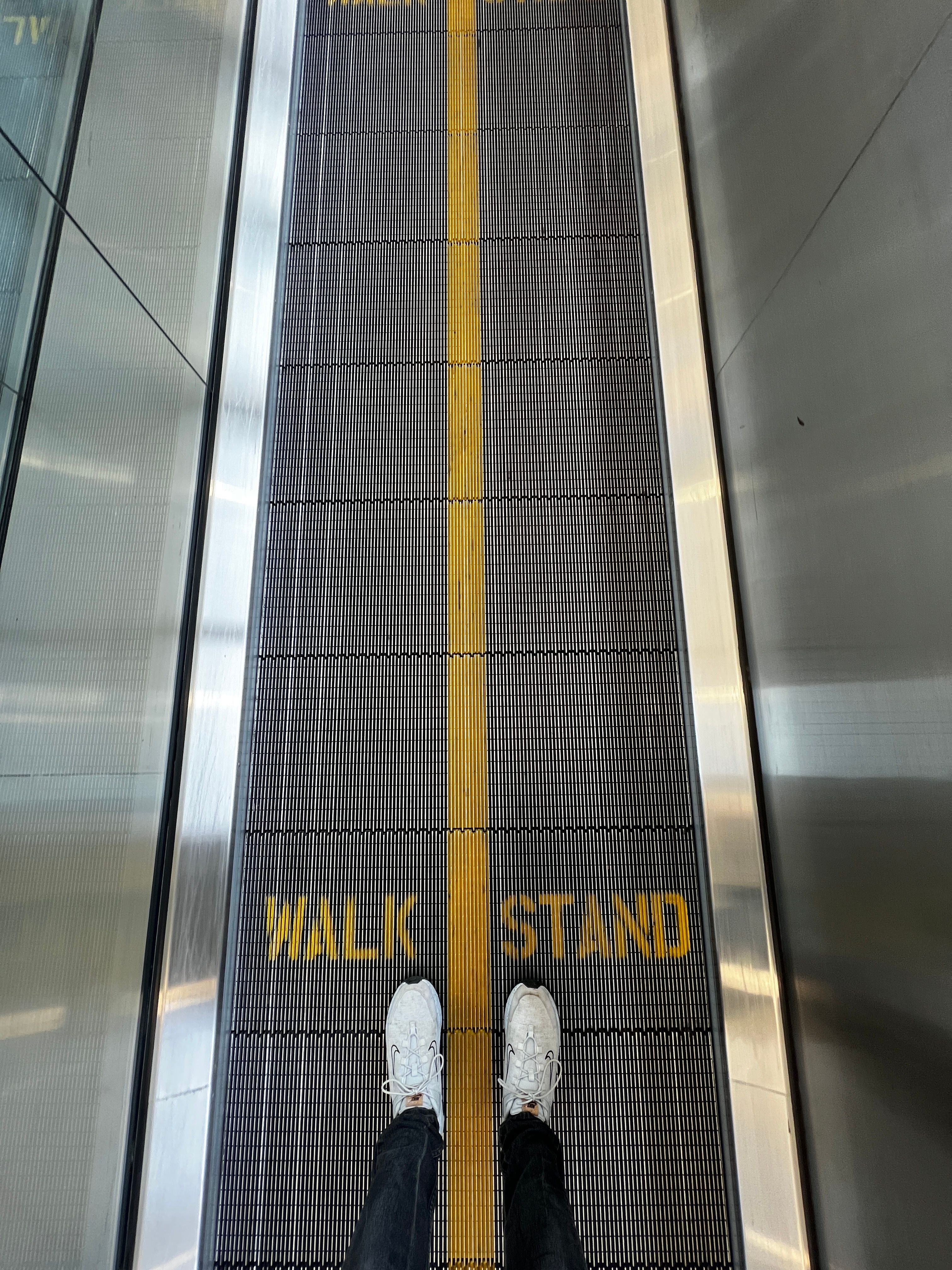 Legs on Moving Sidewalk · Free Stock Photo