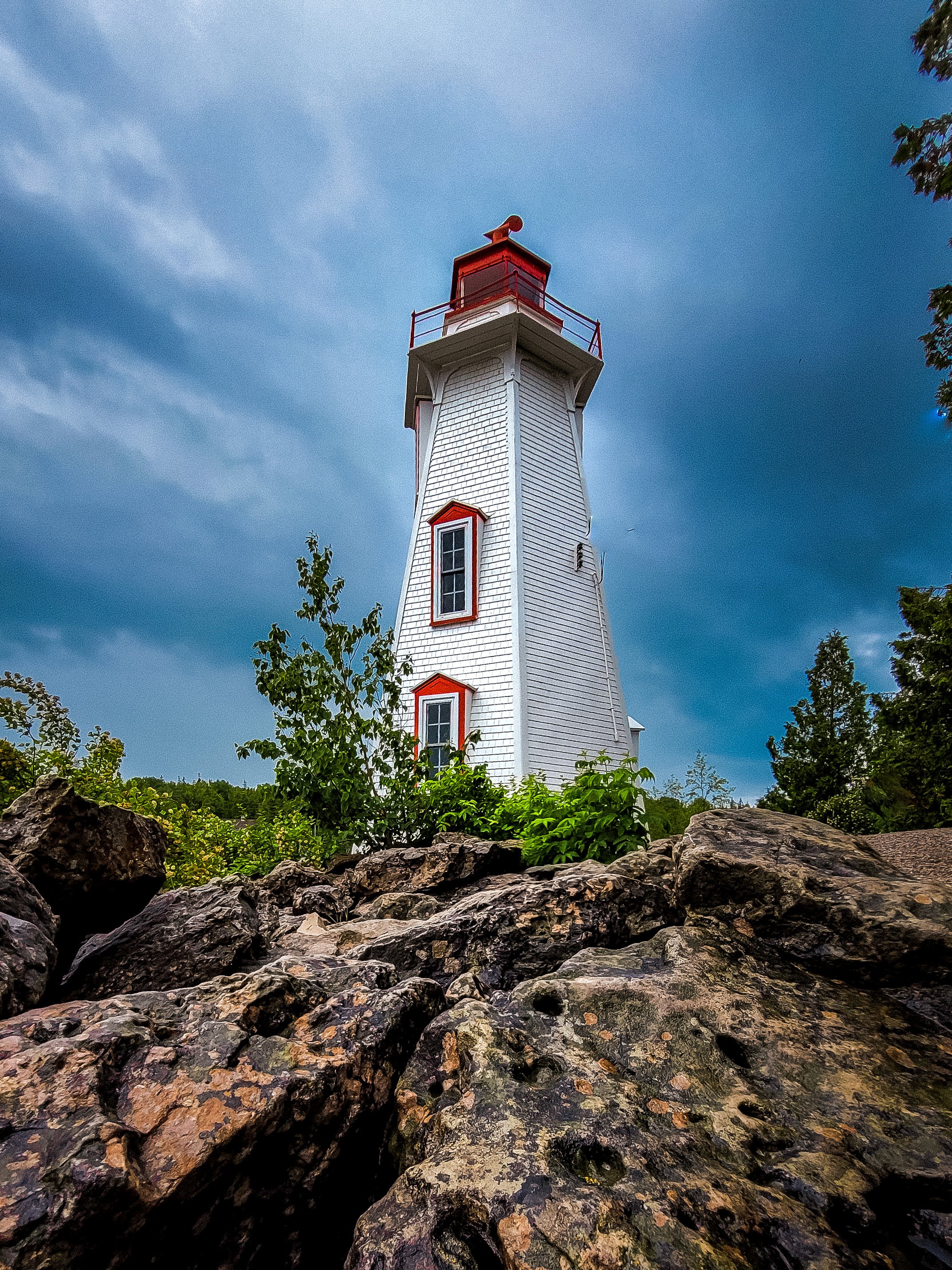 White and Red Lighthouse on Brown Field Under the Blue Sky · Free Stock ...