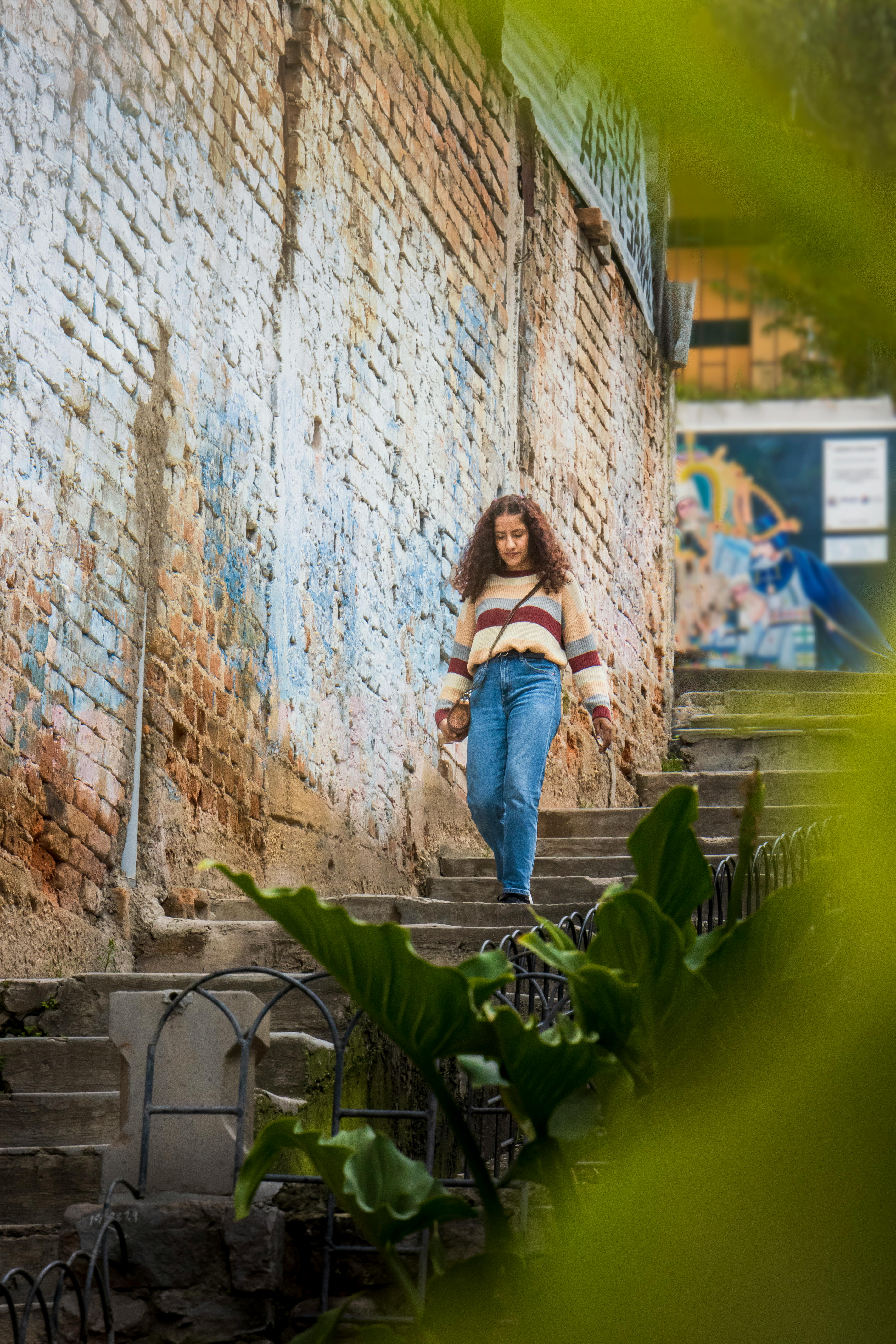 Woman Walking Down the Stairs · Free Stock Photo