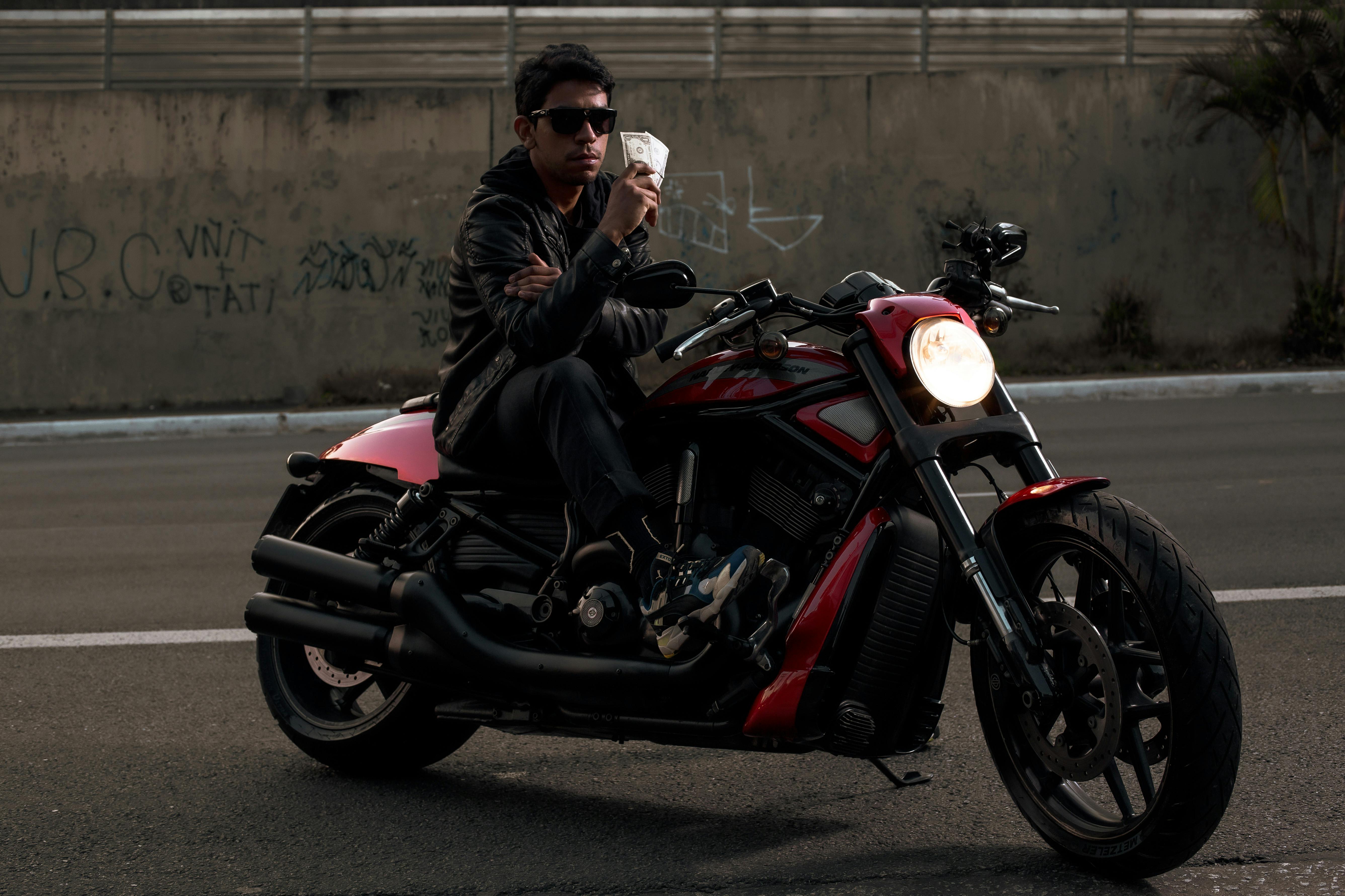 Person Riding a Black and Red Motorcycle · Free Stock Photo