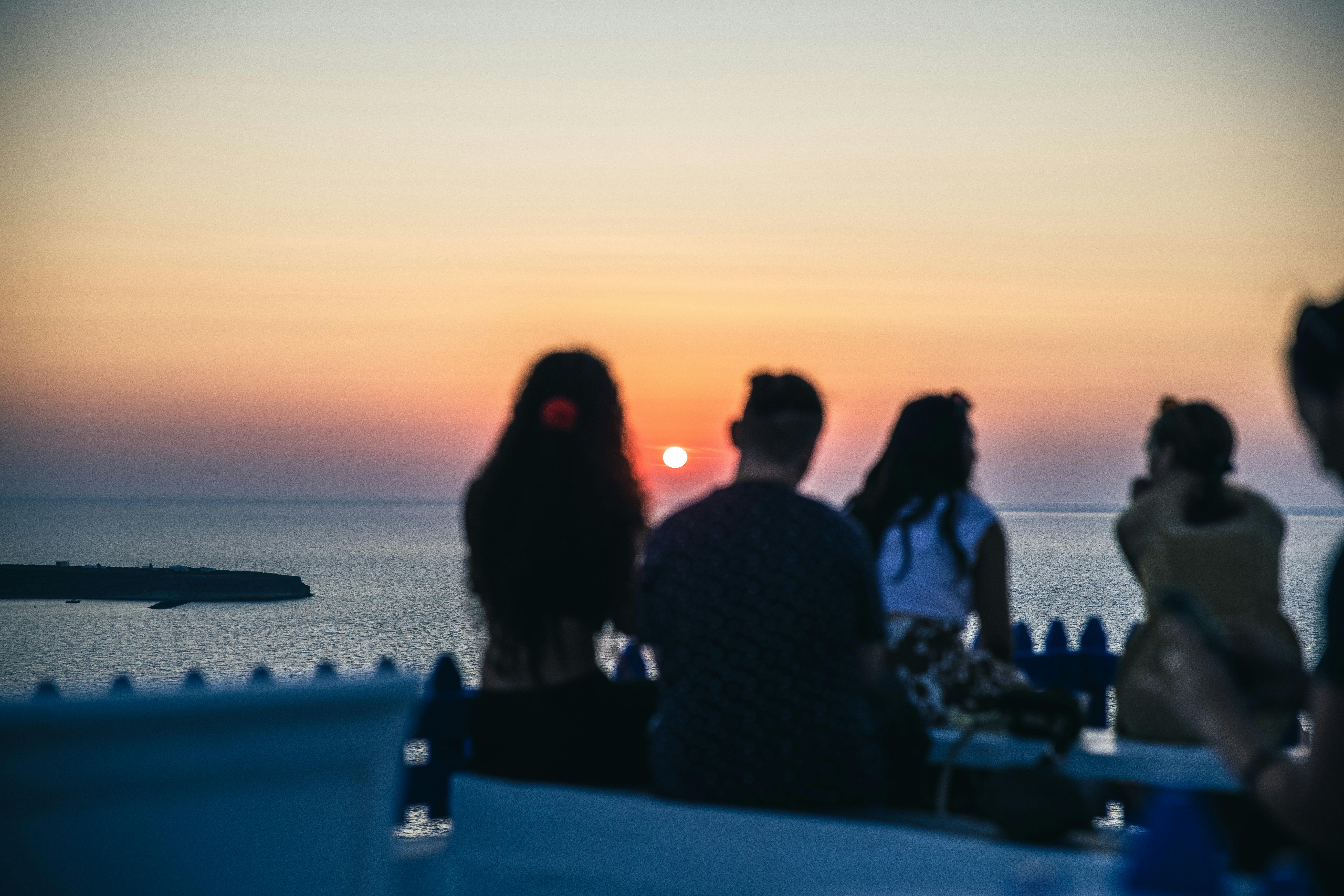 Woman Facing Sunset in Mountains · Free Stock Photo