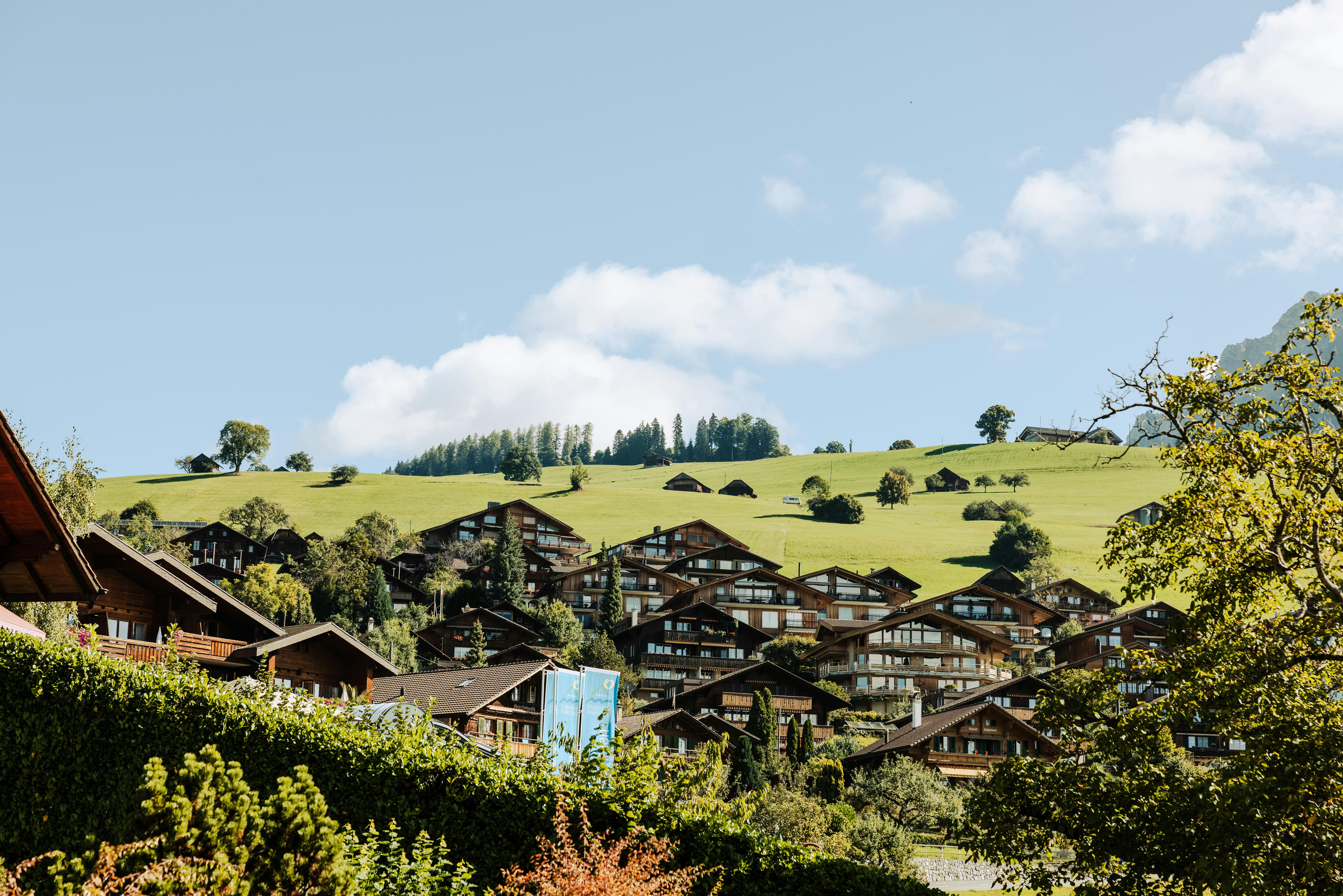 Cottages on Hill in Mountains Landscape · Free Stock Photo