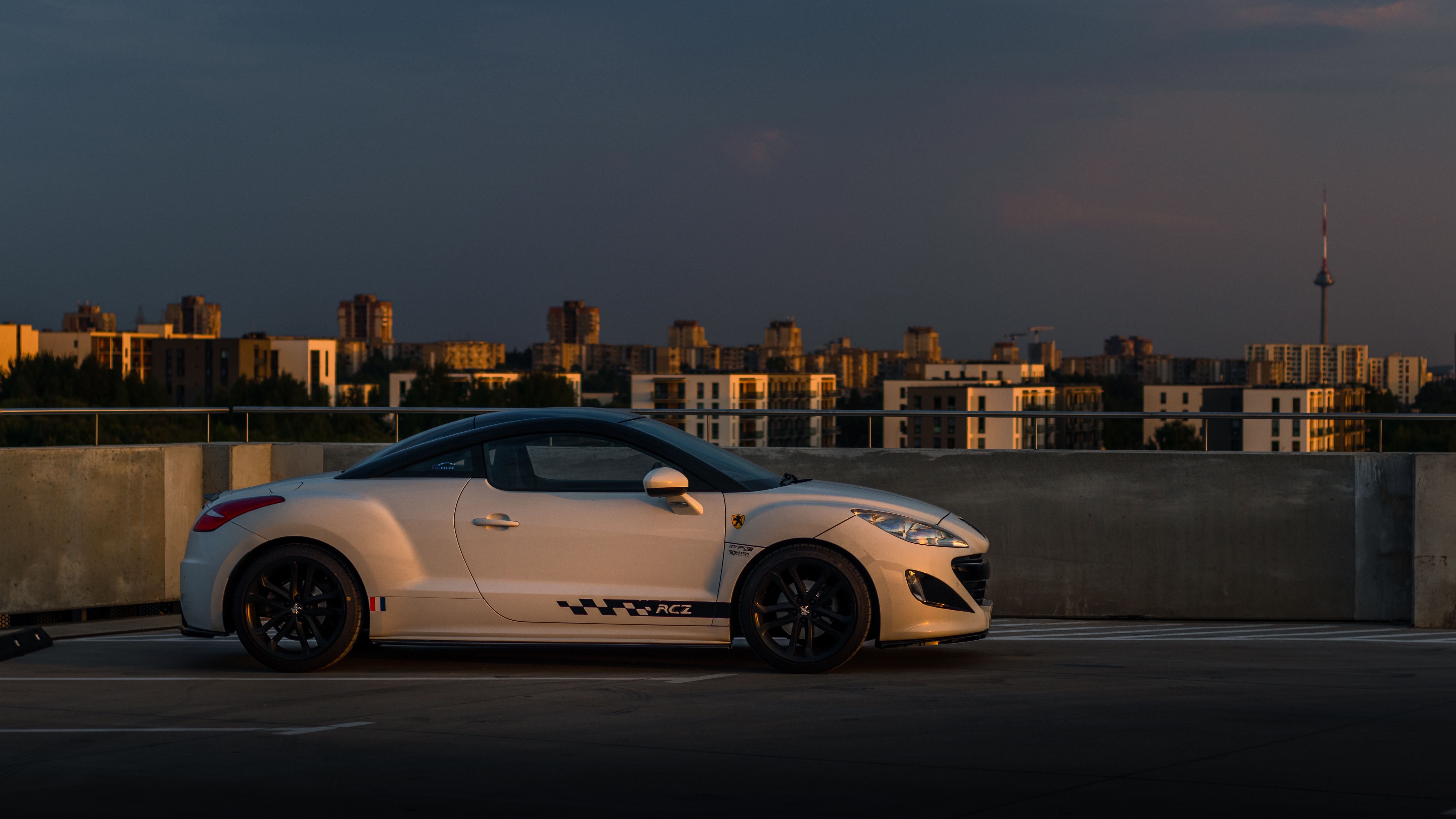 White Car on Rooftop · Free Stock Photo