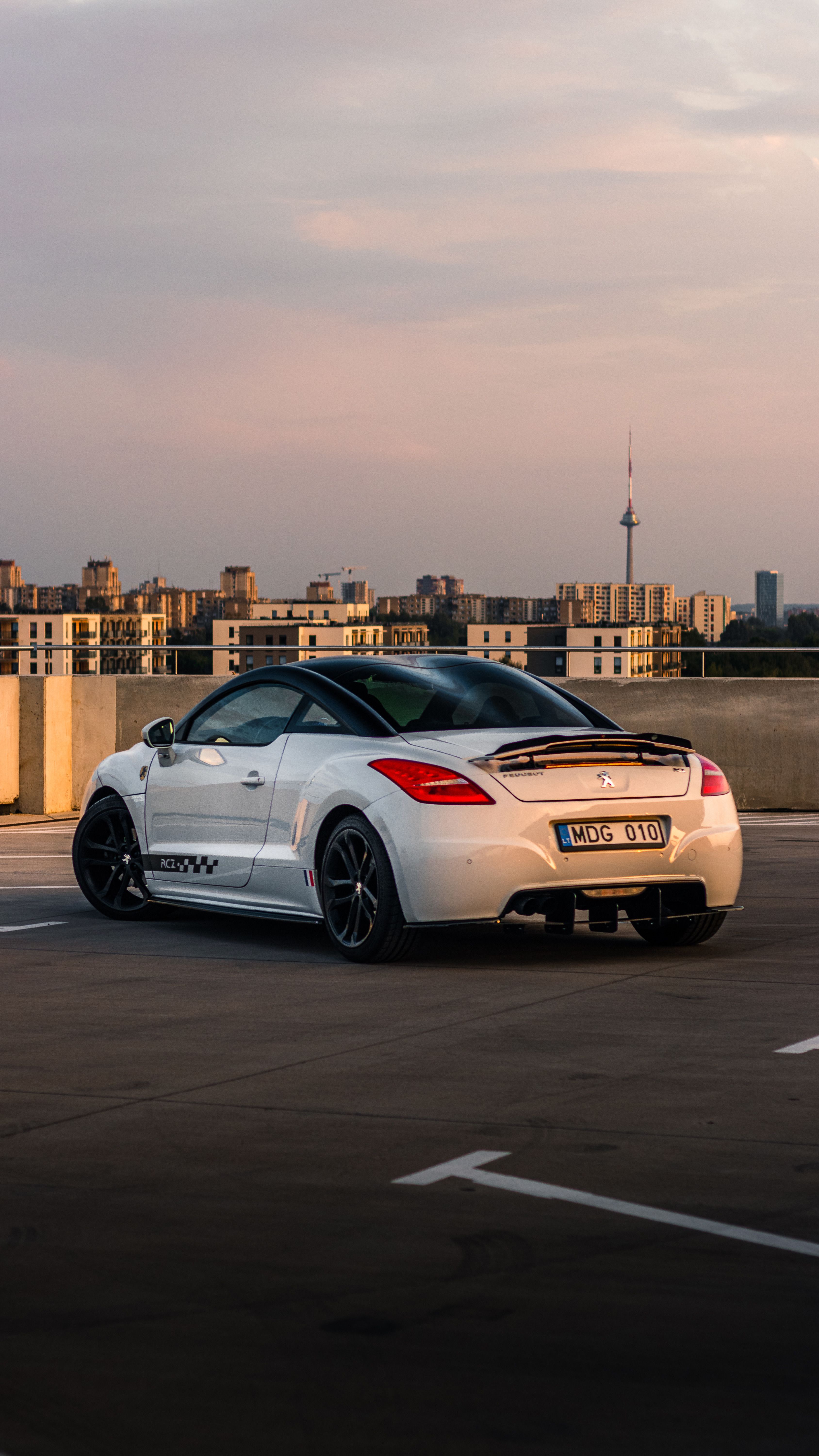 White Car on Rooftop · Free Stock Photo