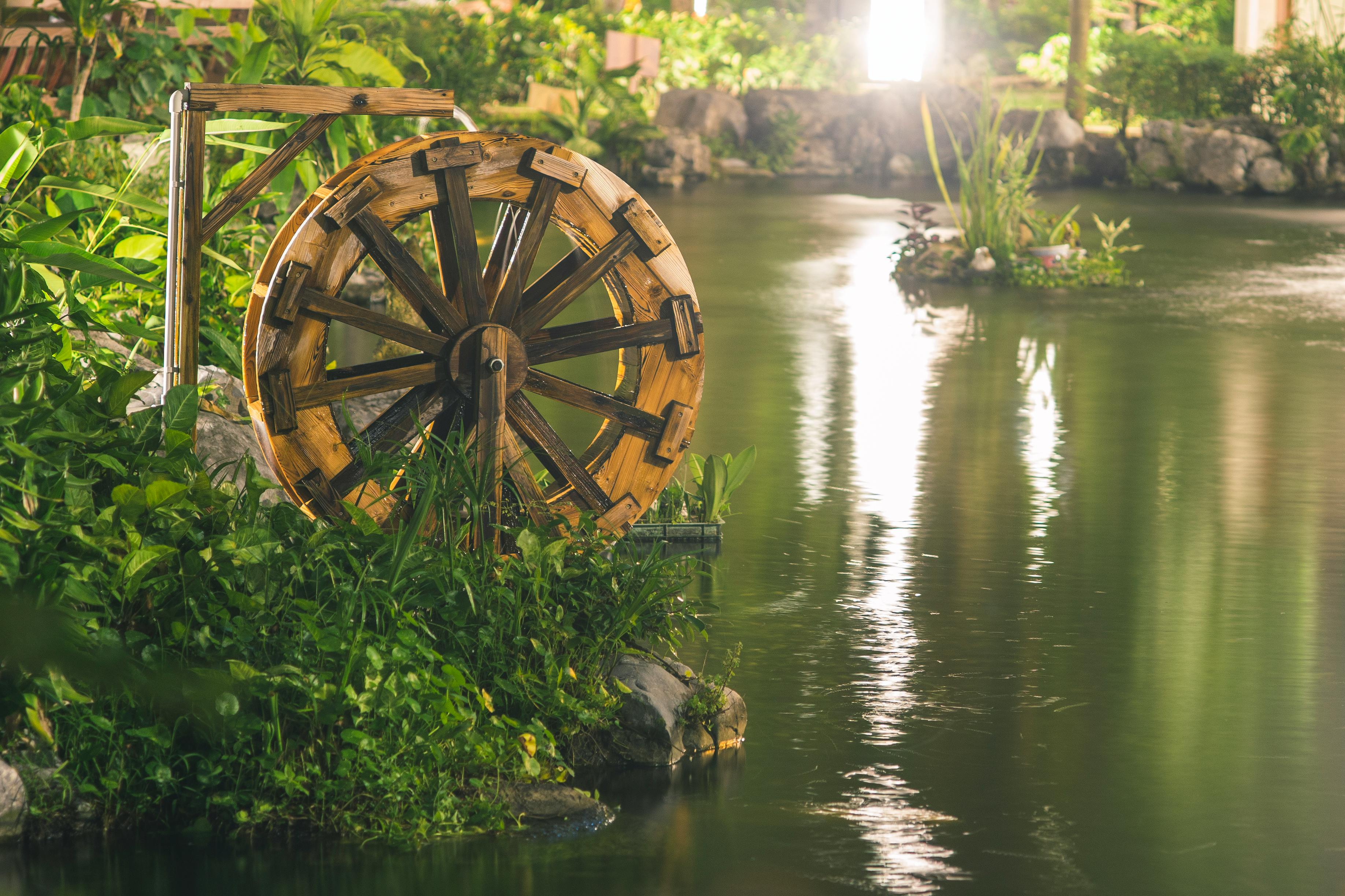 Brown Water Wheel Near Body Of Water · Free Stock Photo