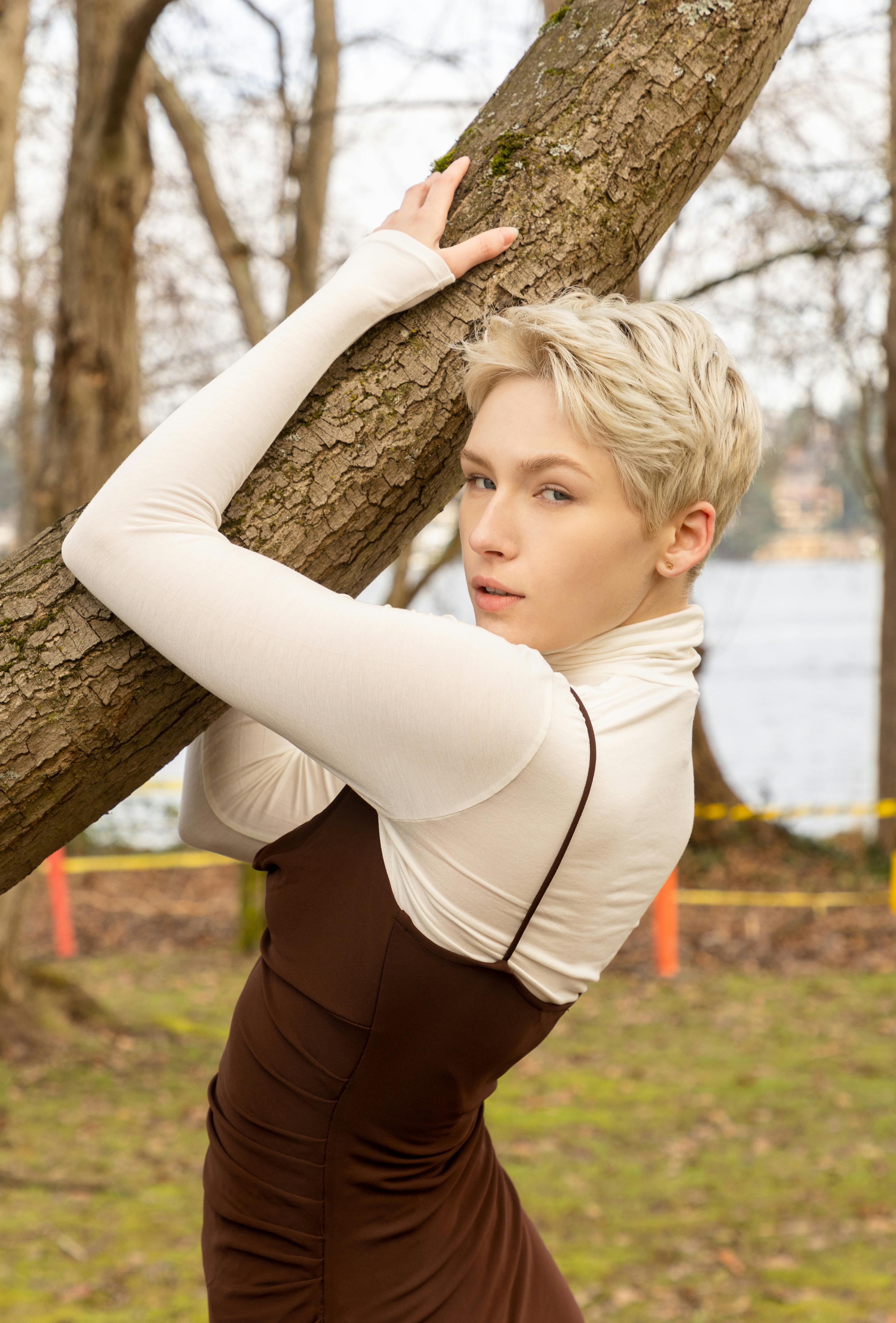 Woman with Short Blonde Hair Posing Outdoors · Free Stock Photo