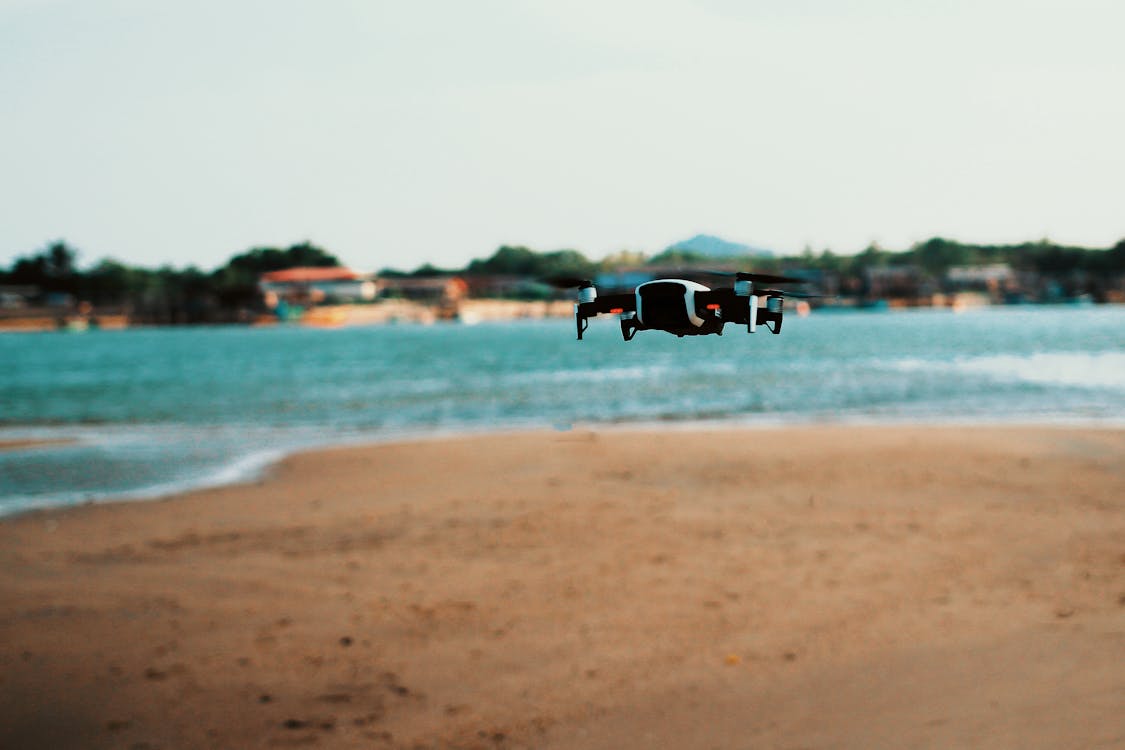Black Quadcopter Drone On Flight Free Stock Photo black-quadcopter-drone-on-flight-free-stock-photo