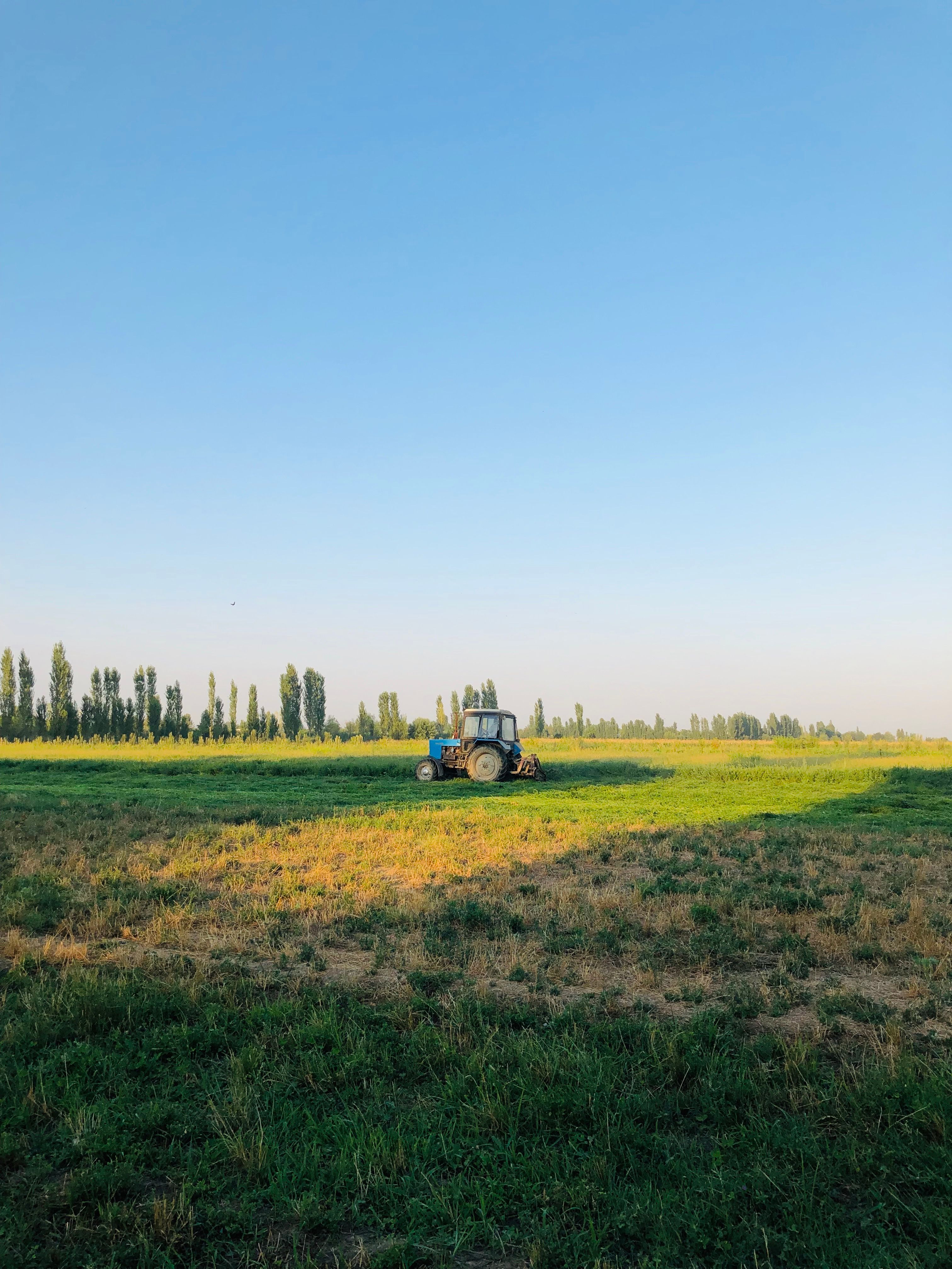 Tractor on Grass Field · Free Stock Photo