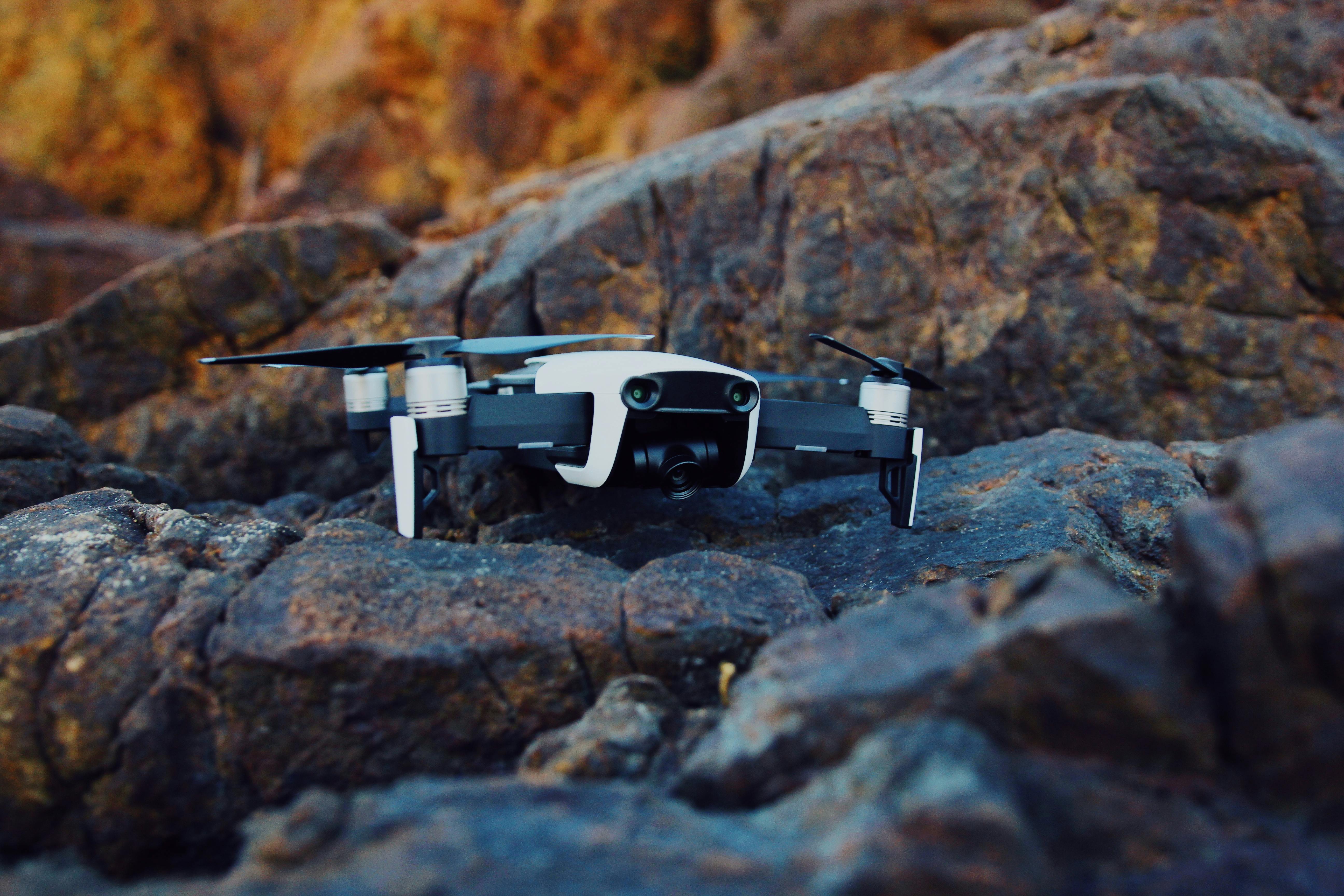 Shallow Focus Photography of White and Black Quadcopter Drone · Free ...