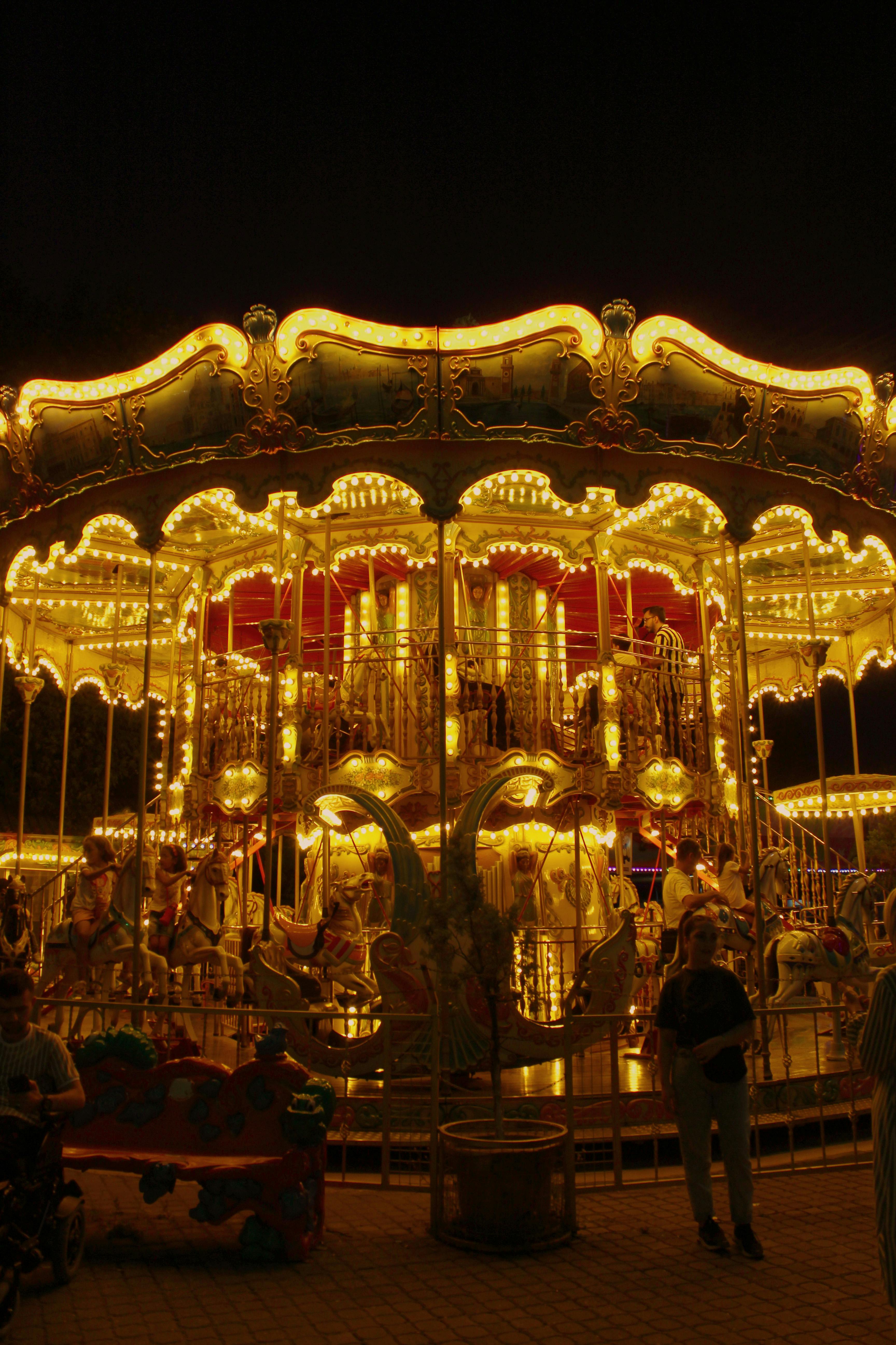 A Carousel Moving at Night · Free Stock Photo