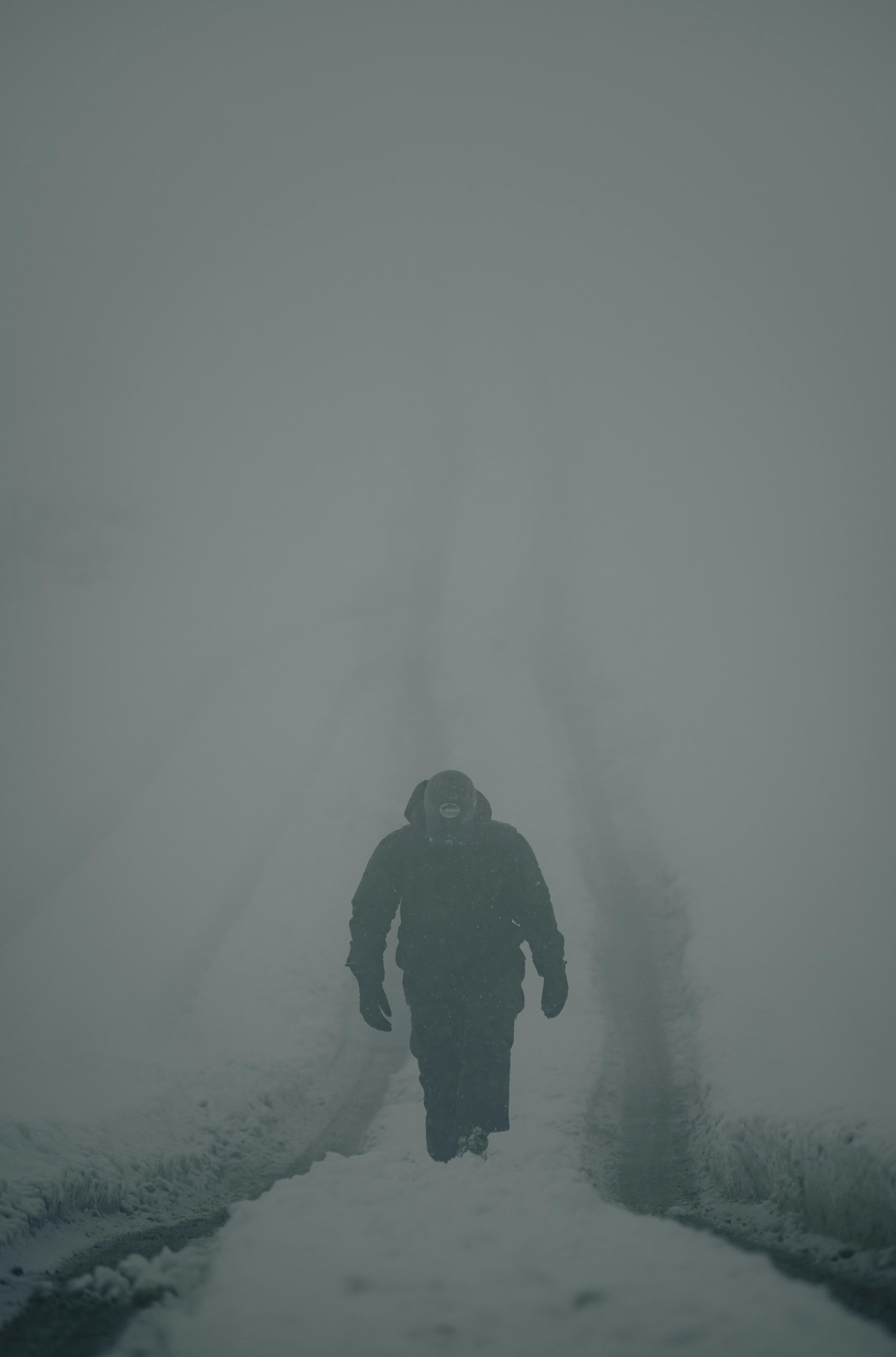Person Walking in Snow and Fog · Free Stock Photo