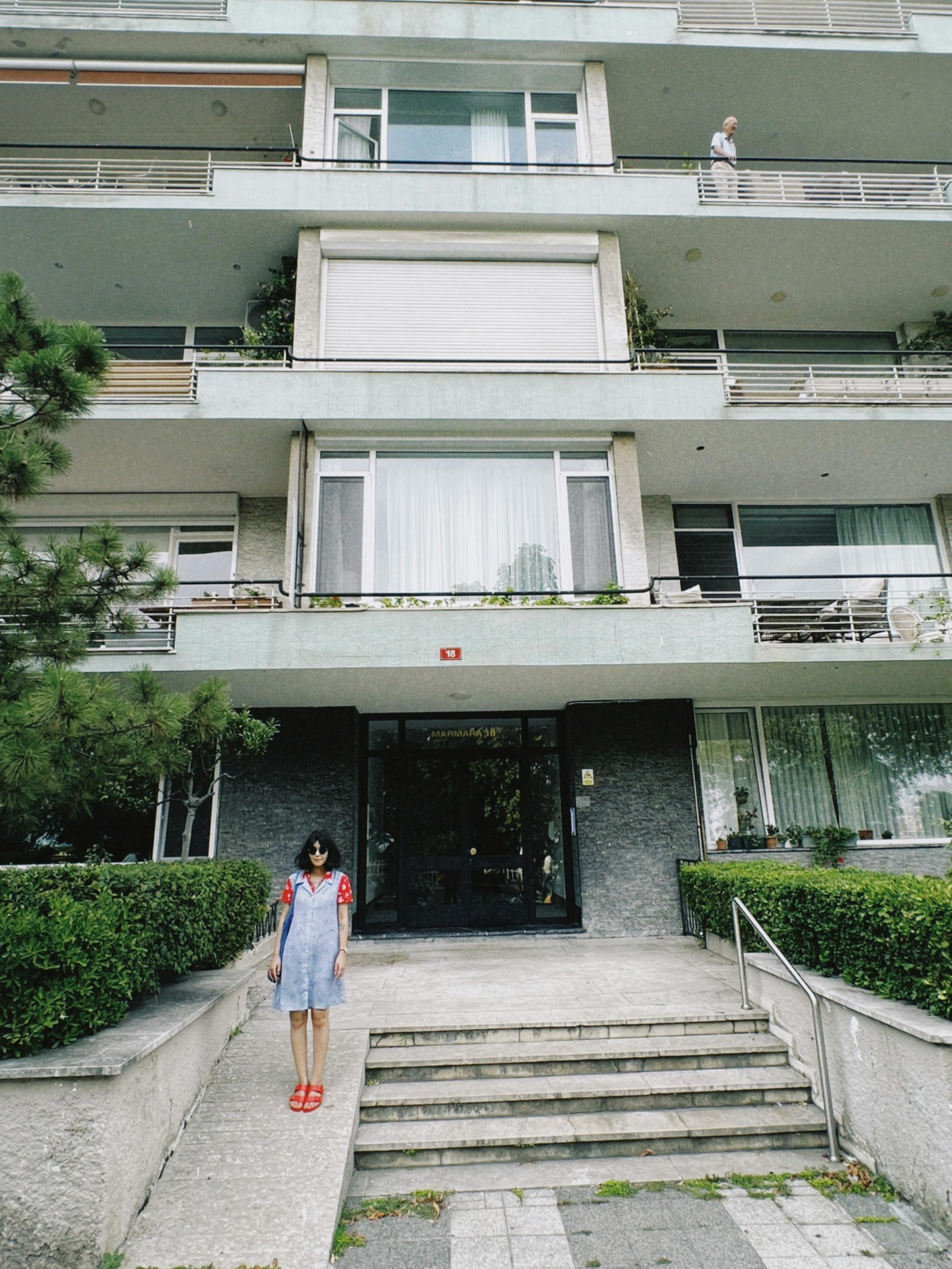 A Woman Standing on a Ramp in Front of a Building · Free Stock Photo