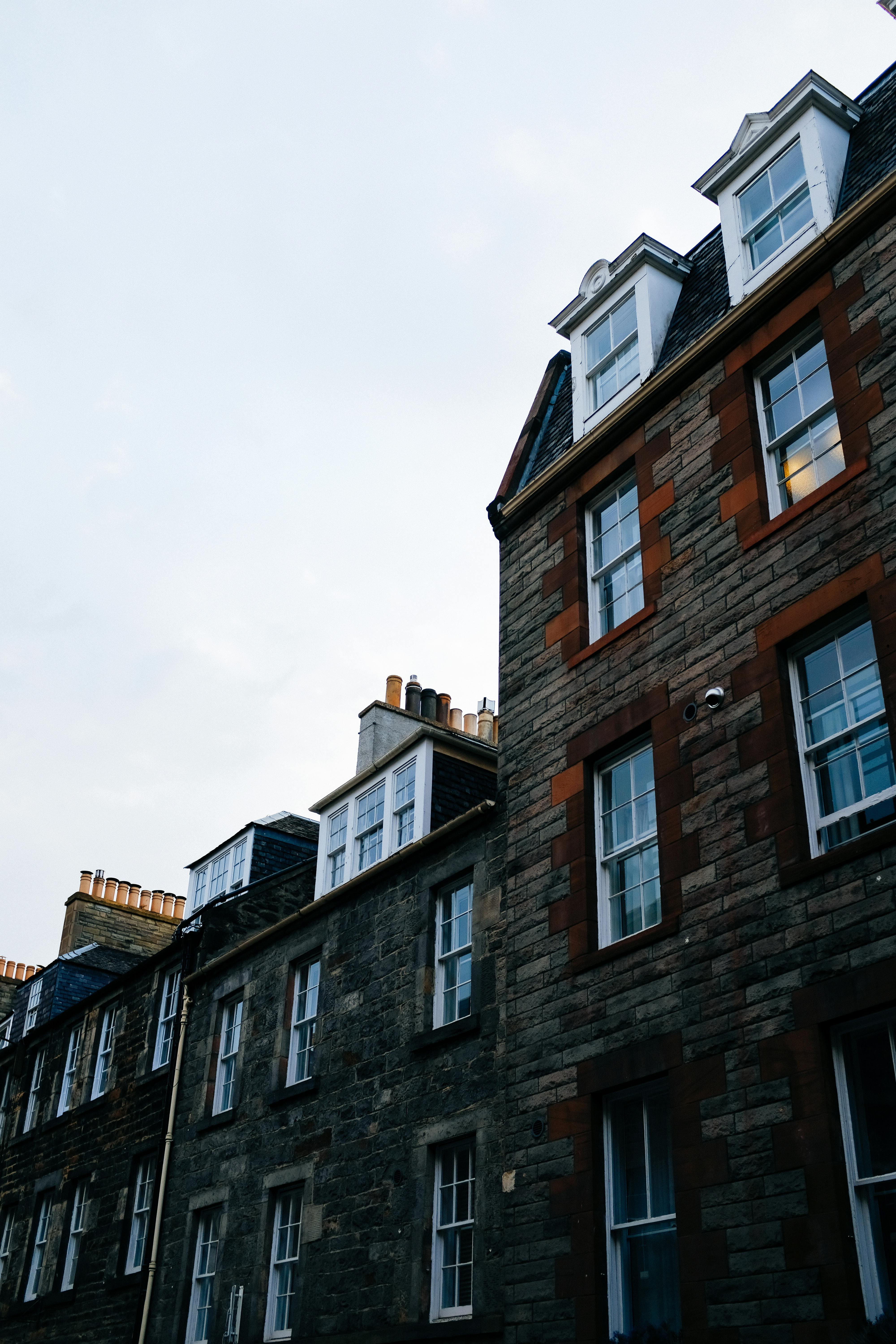 Windows of a Row of Townhouses · Free Stock Photo