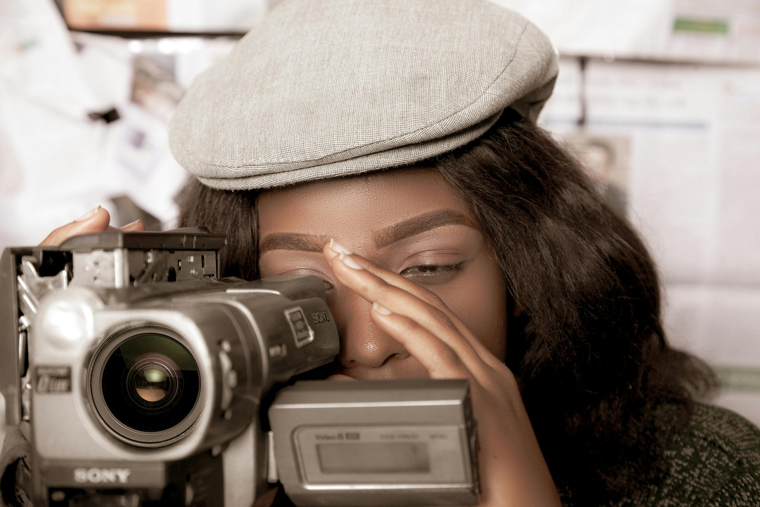 Woman Using a Sony Video Camera · Free Stock Photo