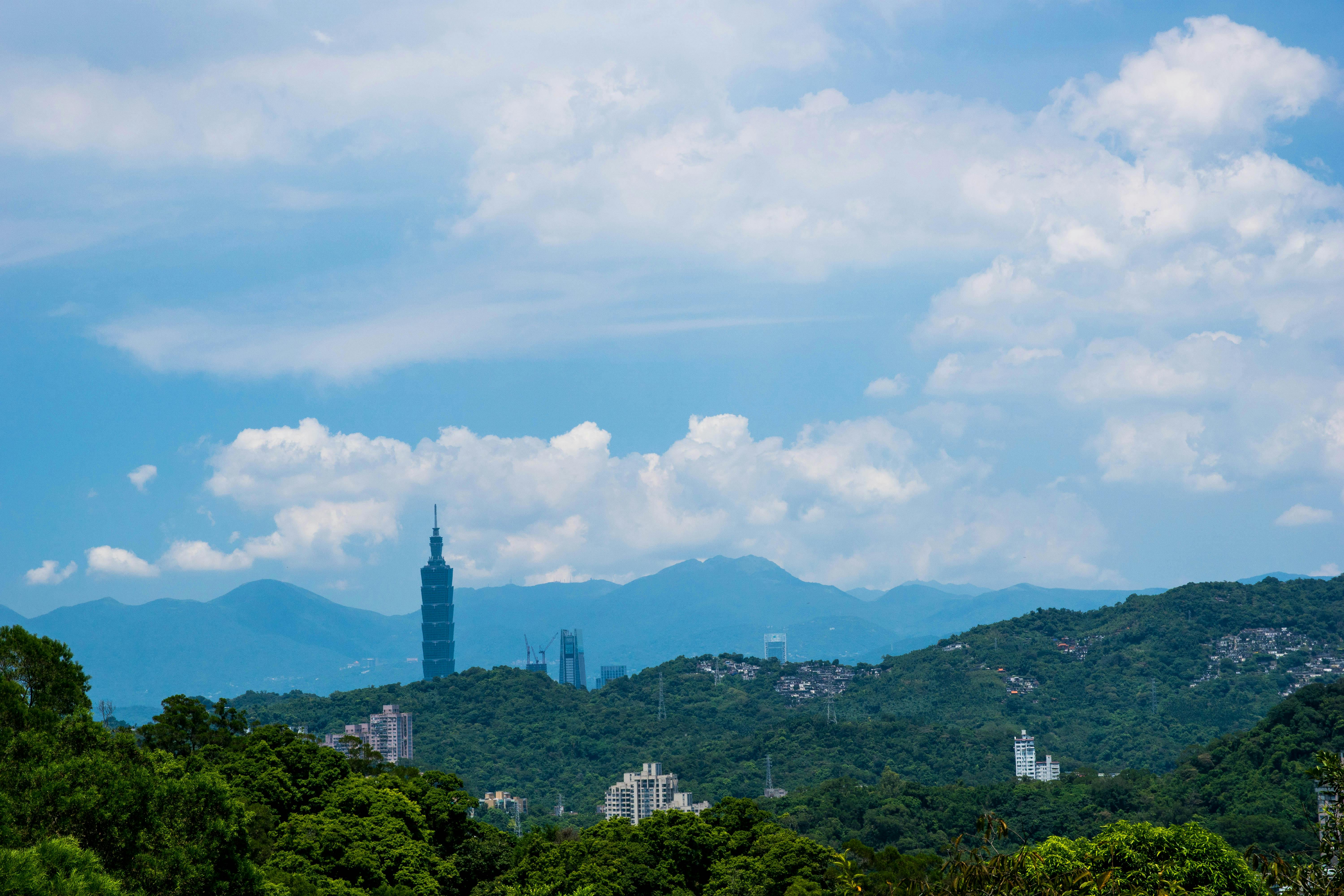 High Rise Building Under a Cloudy Sky · Free Stock Photo