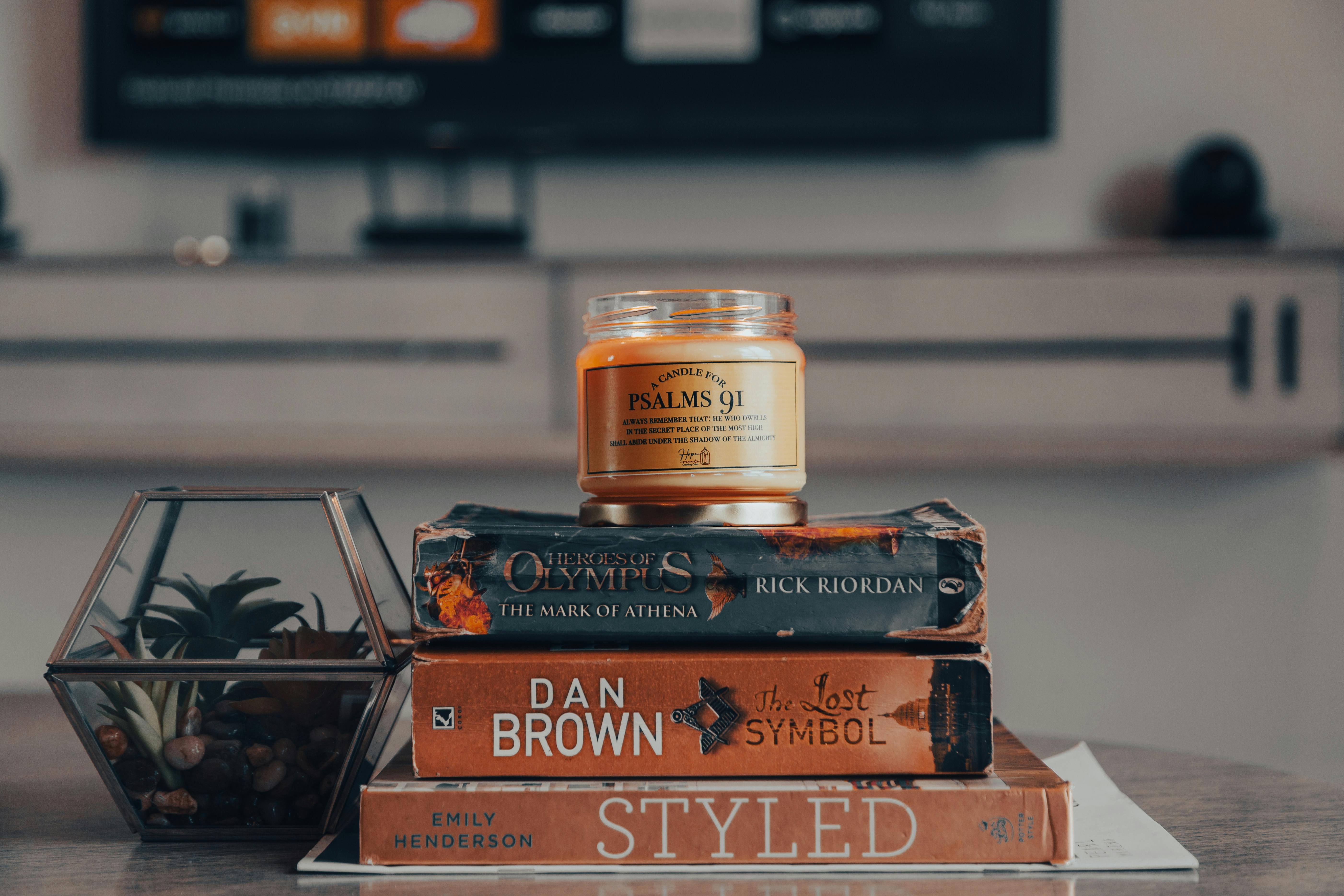 A Scented Candle on a Stack of Books · Free Stock Photo