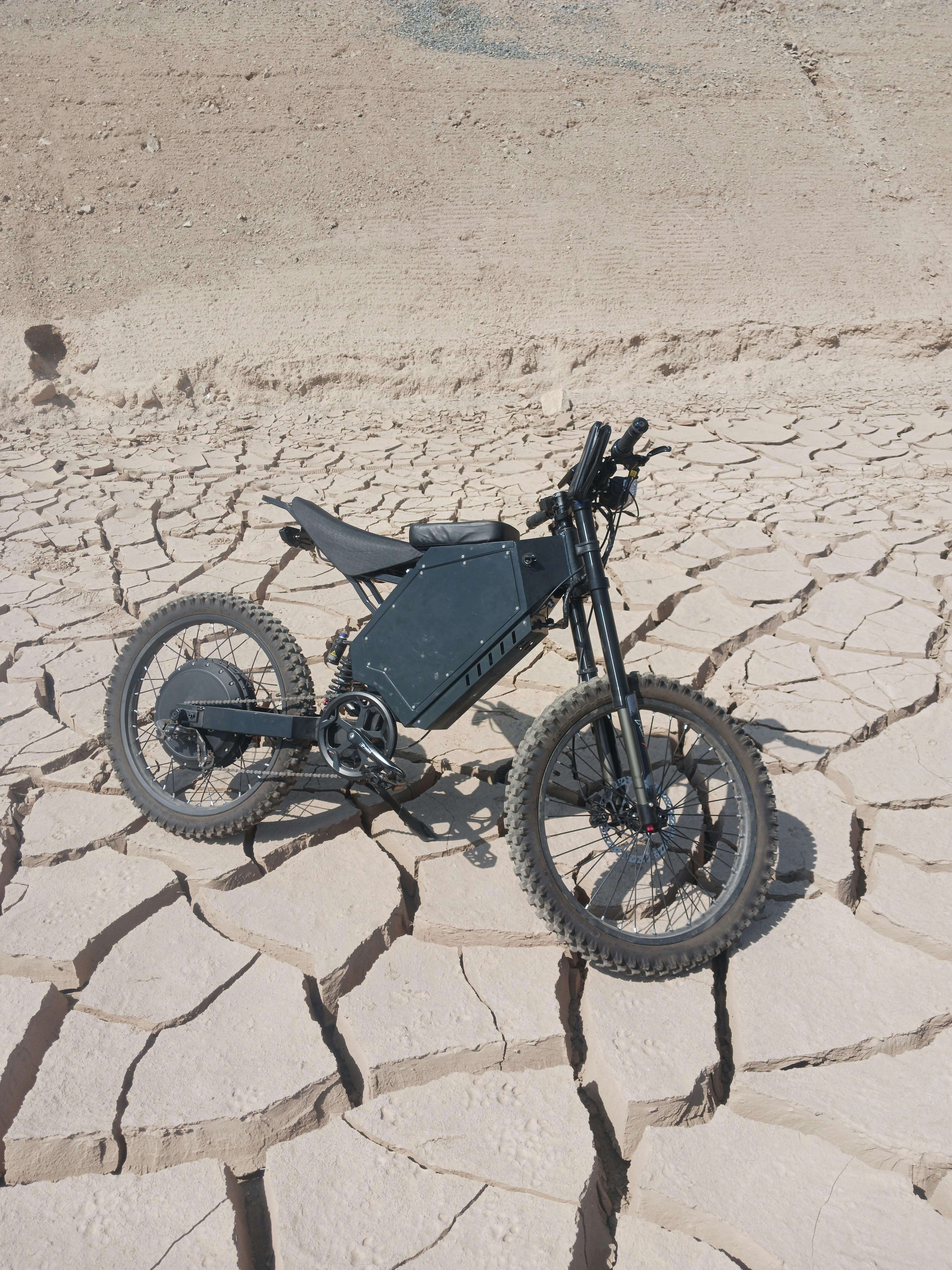 Motorcycle Parked on the Parched Desert · Free Stock Photo