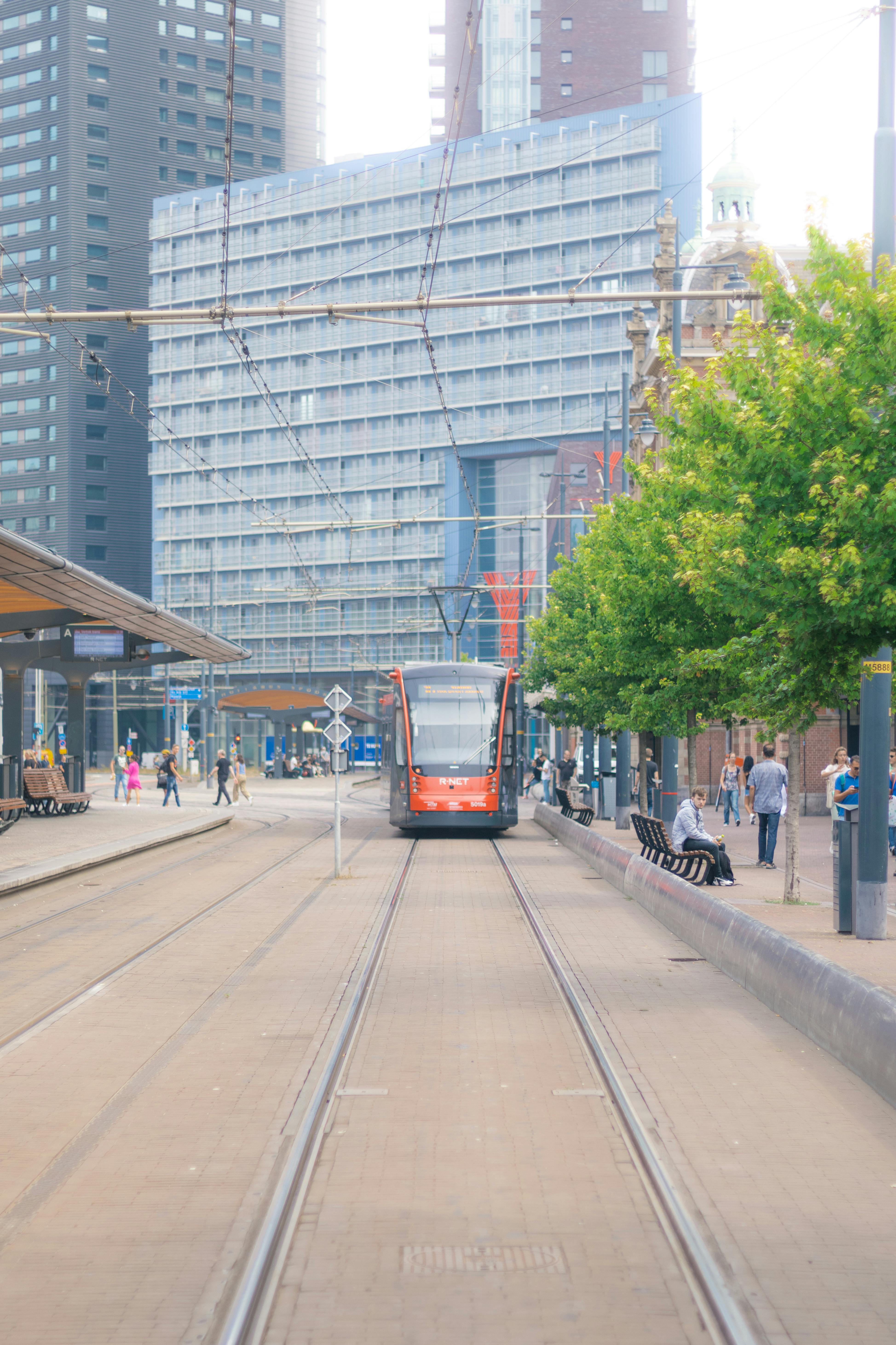 Turquoise Tramway With Tall Downtown Skyscrapers in the Background ...