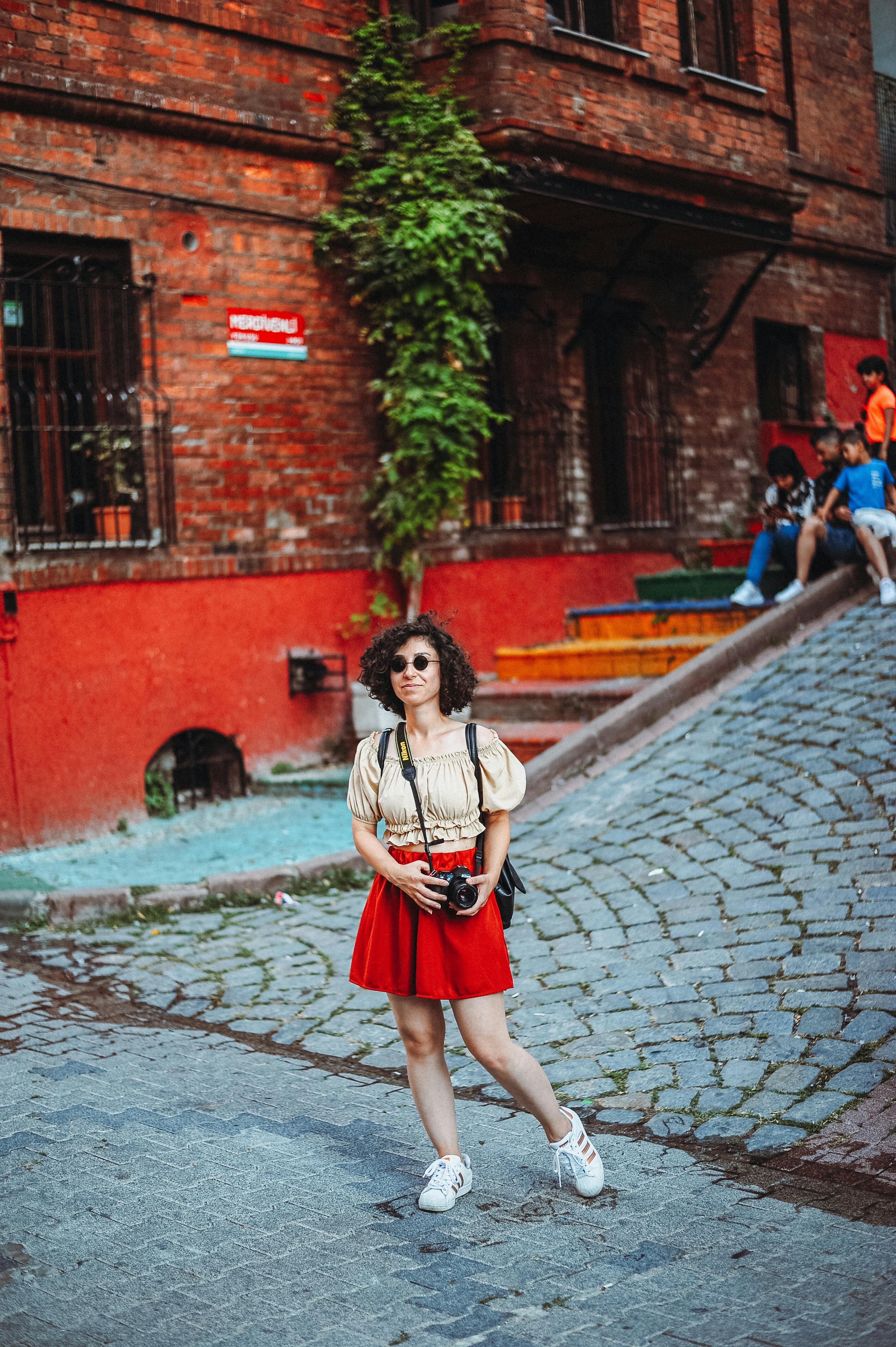 Woman in Casual Wear with a Camera · Free Stock Photo