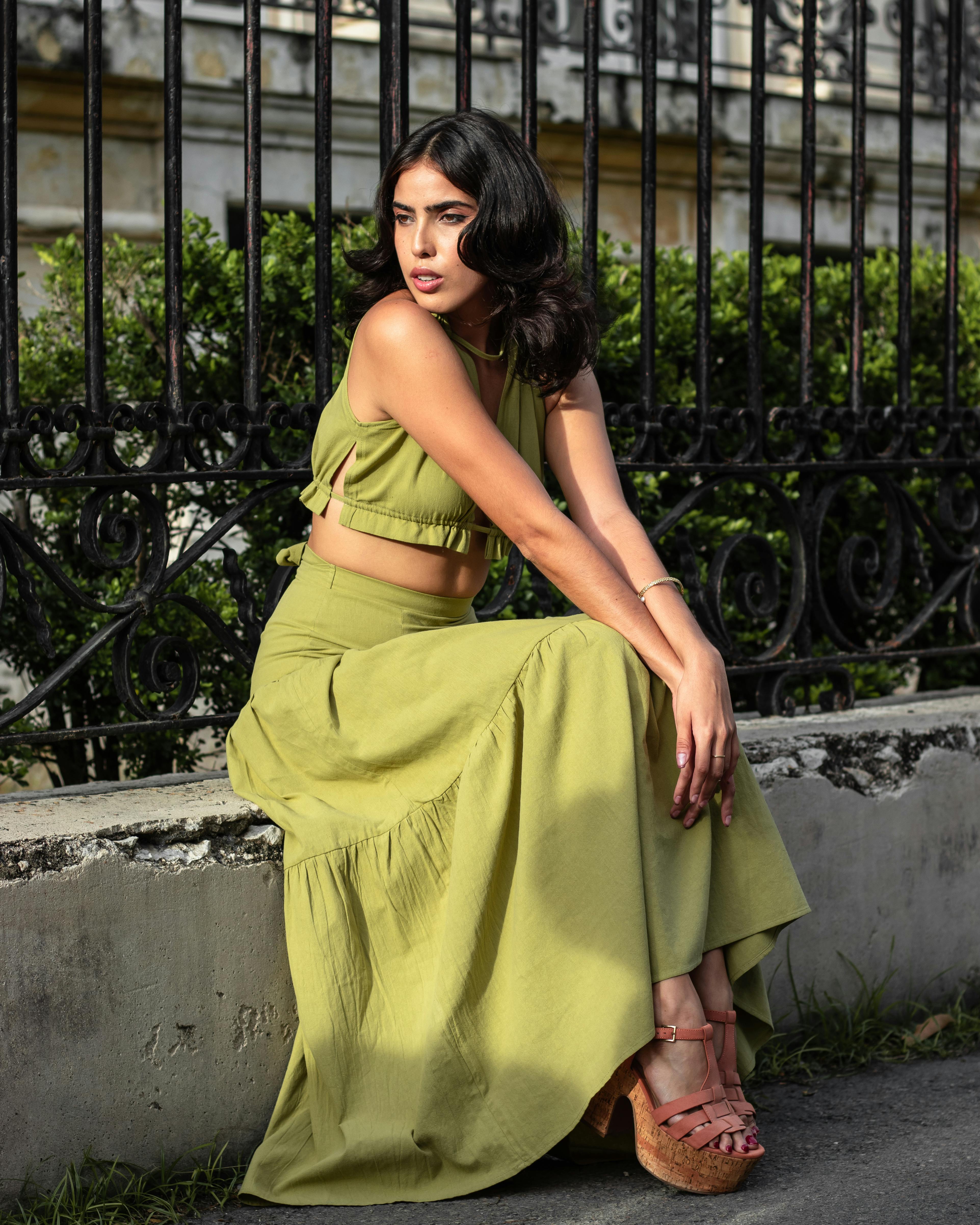 Female Fashion Model Posing in a Red Leather Dress · Free Stock Photo