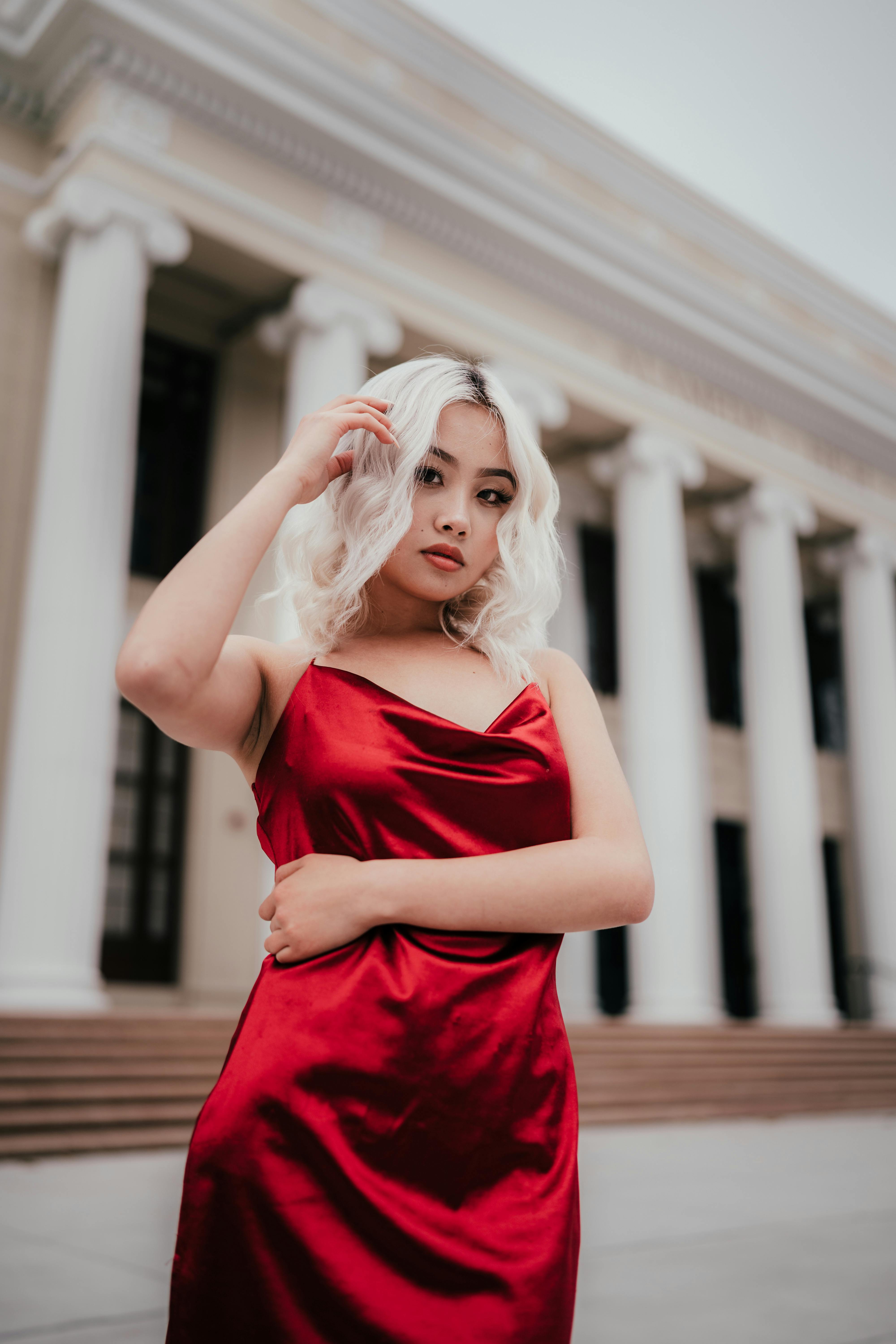 A Woman in Pilot Uniform Standing Infront of Helicopter · Free Stock Photo