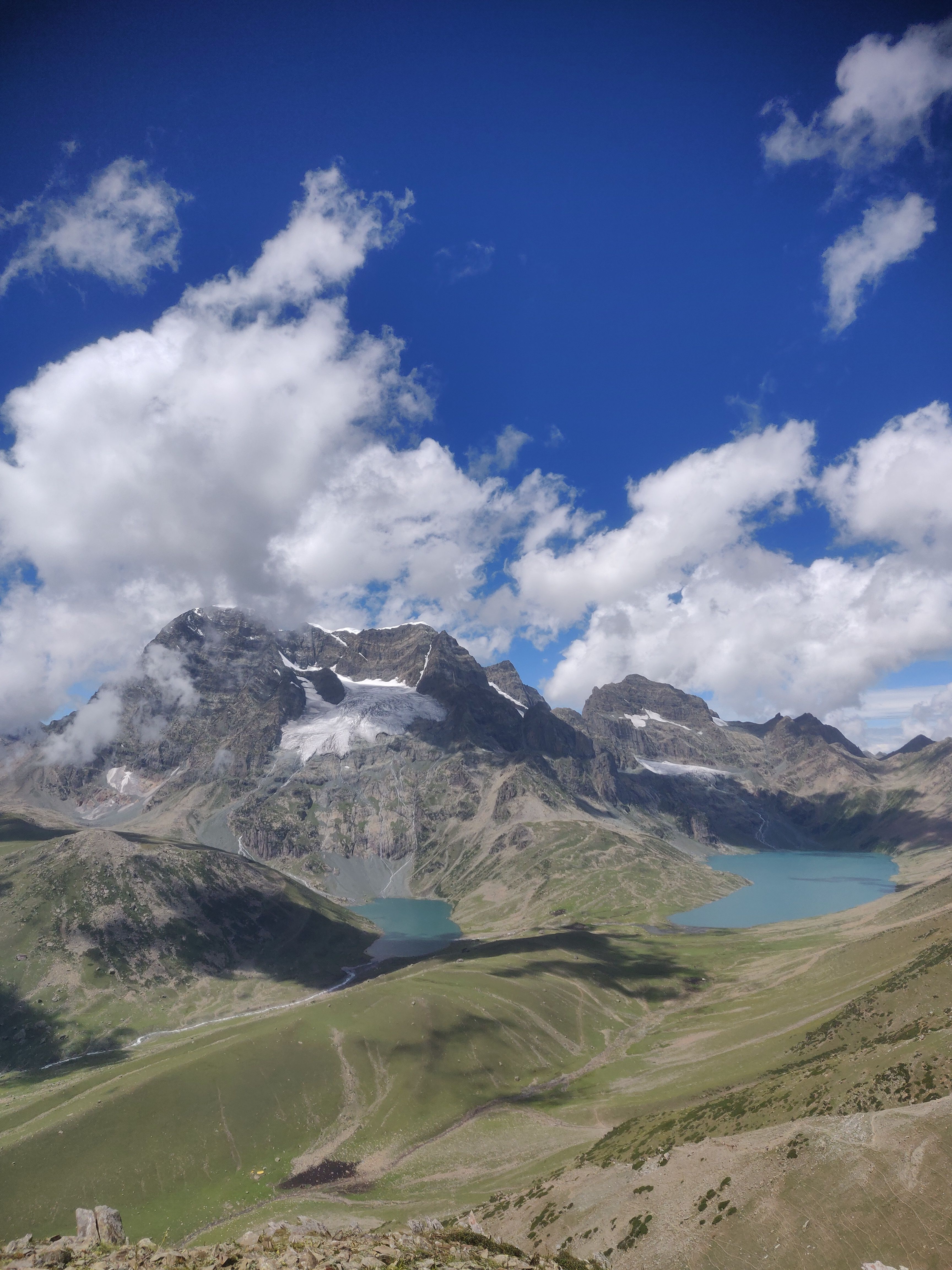 Lake Between Mountains Under Blue Sky with White Clouds · Free Stock Photo
