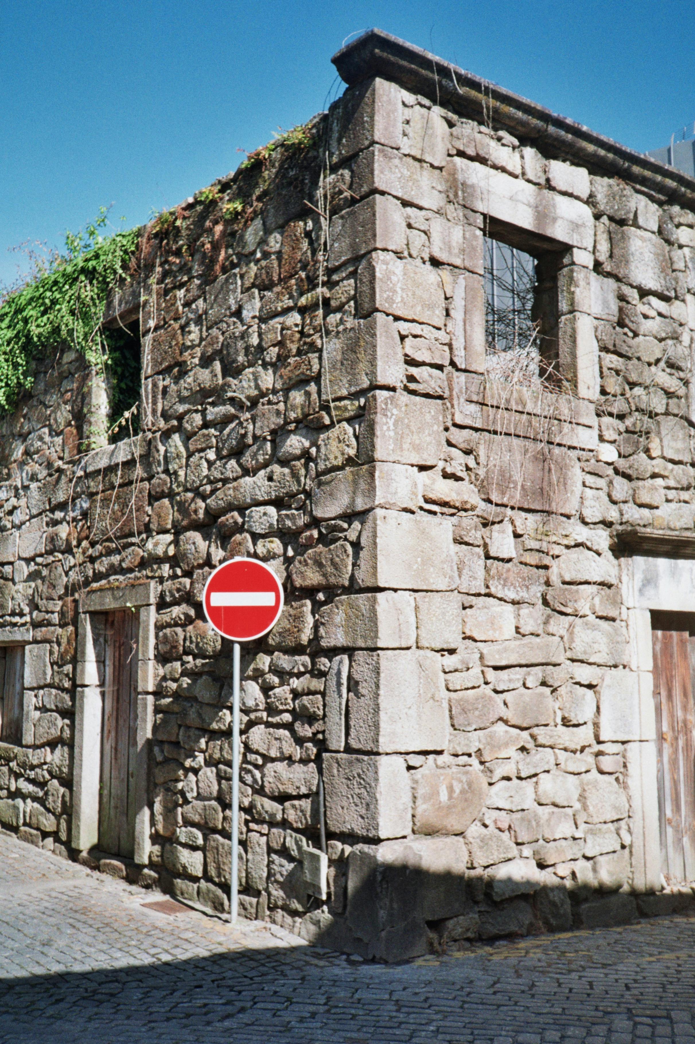 An Old Concrete House on the Corner of the Street · Free Stock Photo
