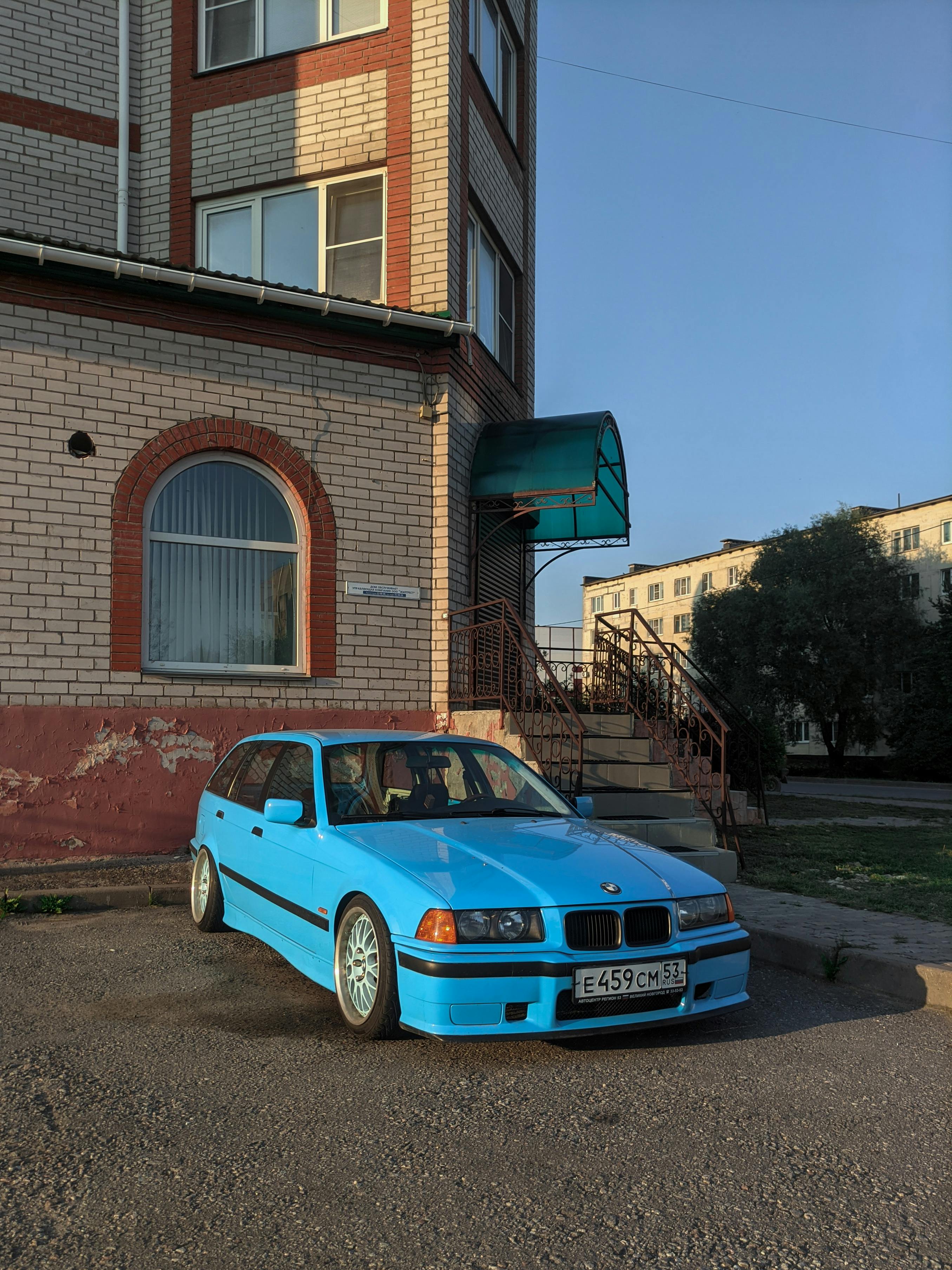 A Parked Blue BMW e36 Wagon · Free Stock Photo