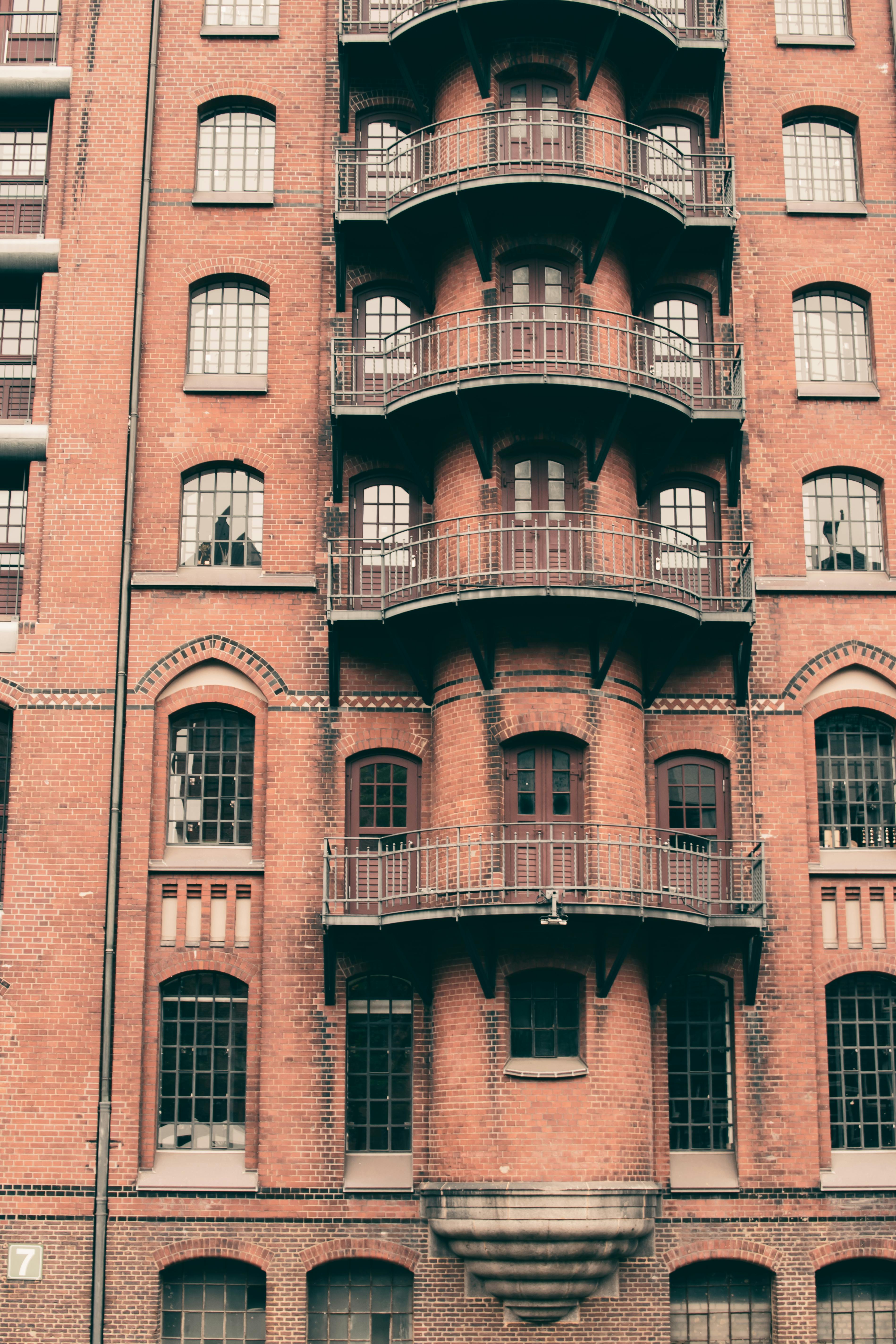 Photo of a Balcony of a Brick Building · Free Stock Photo
