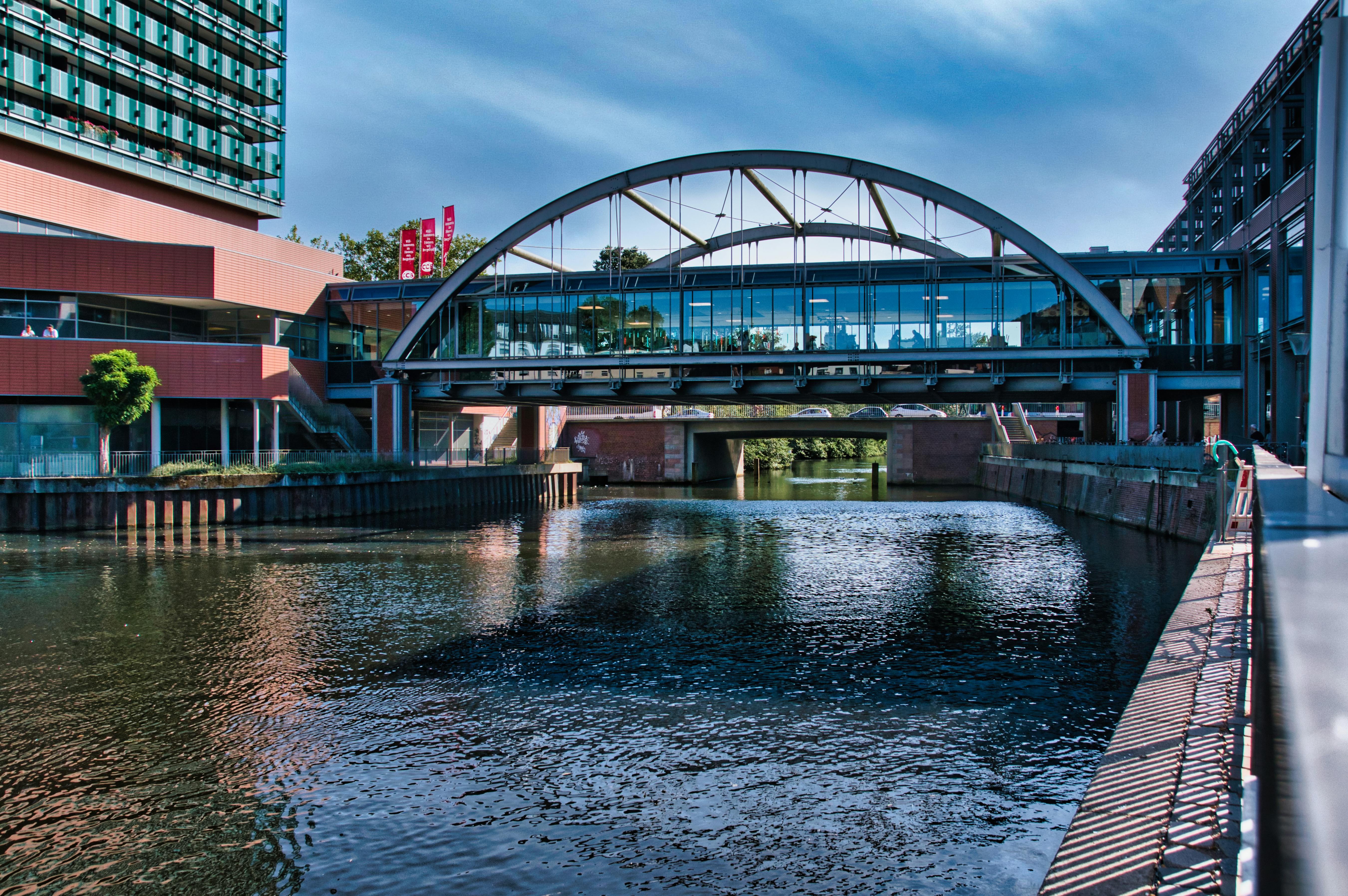 Corridor between Buildings over River · Free Stock Photo