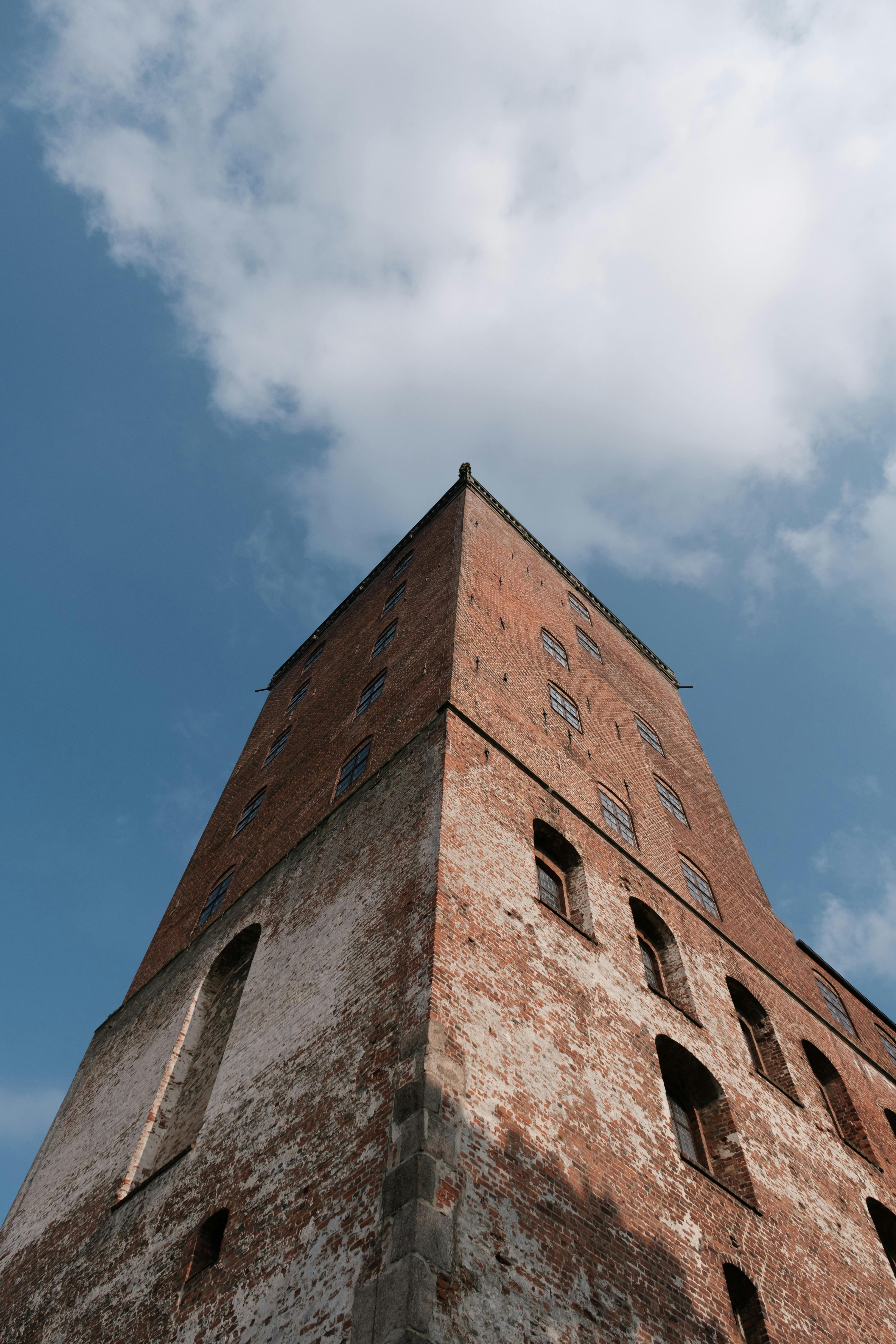 High-Angle Shot of a Concrete Building under the Cloudy Blue Sky · Free ...