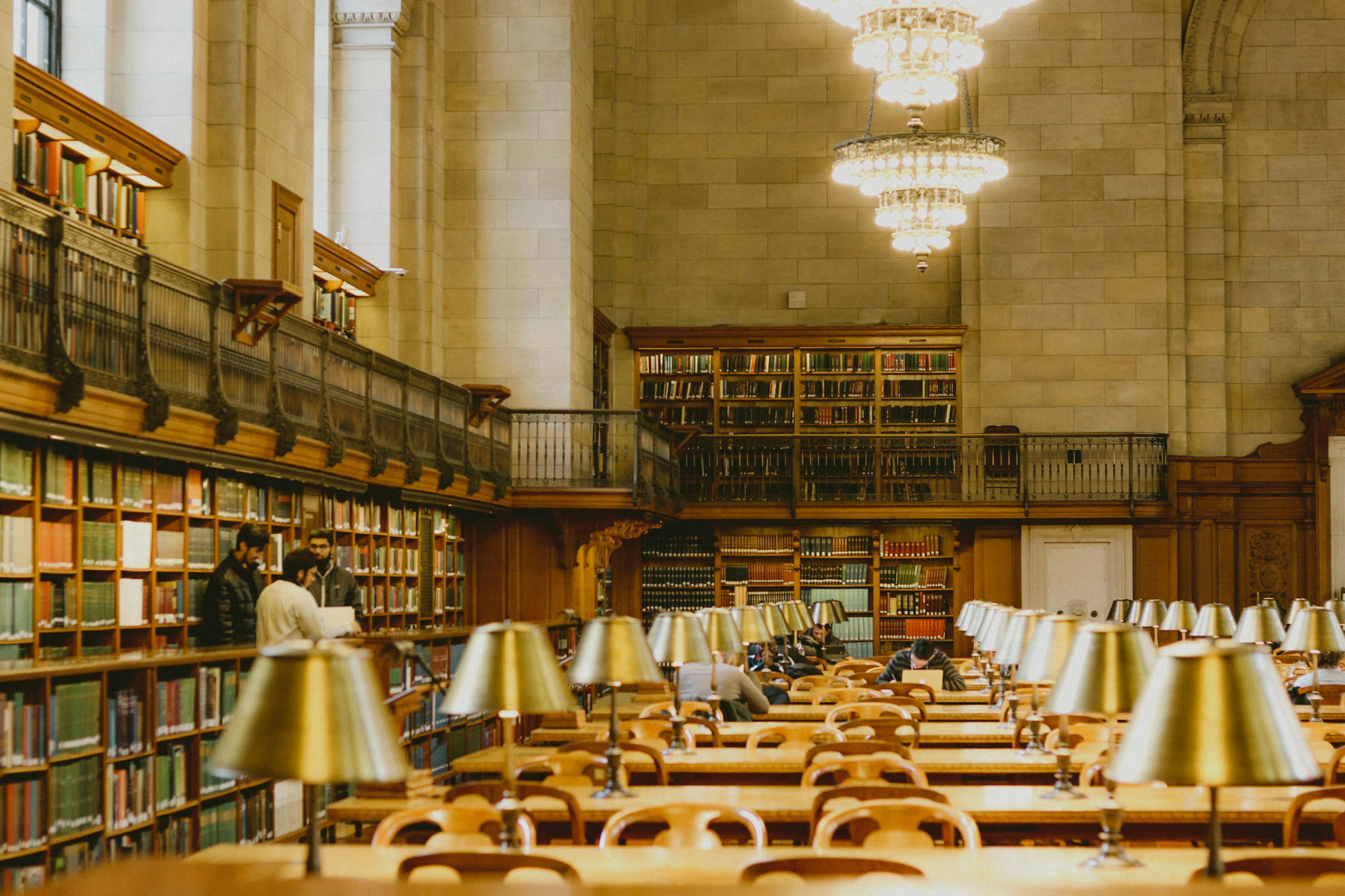 People in Old Ornate Library · Free Stock Photo