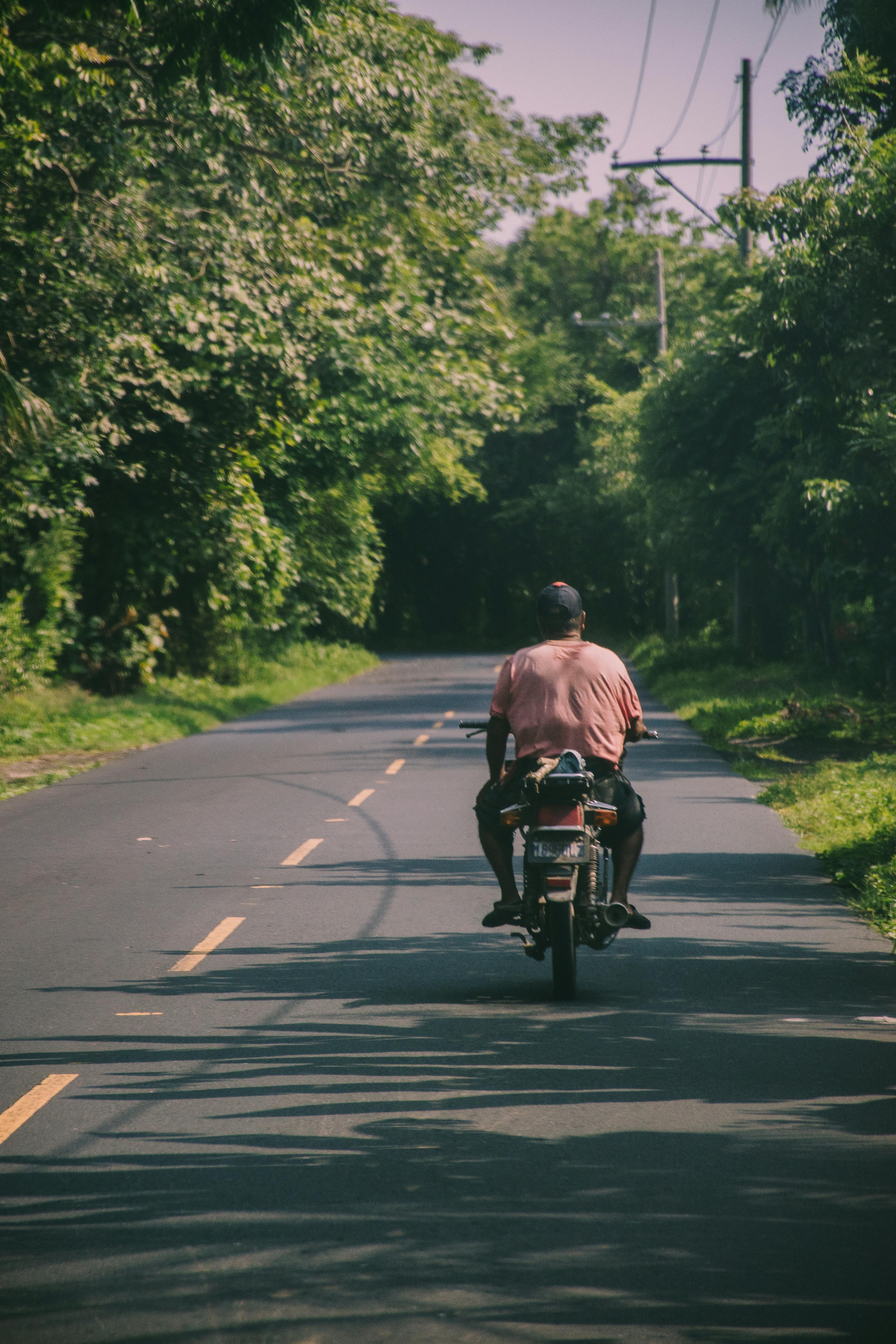 Backview of Man riding a Motorcycle · Free Stock Photo