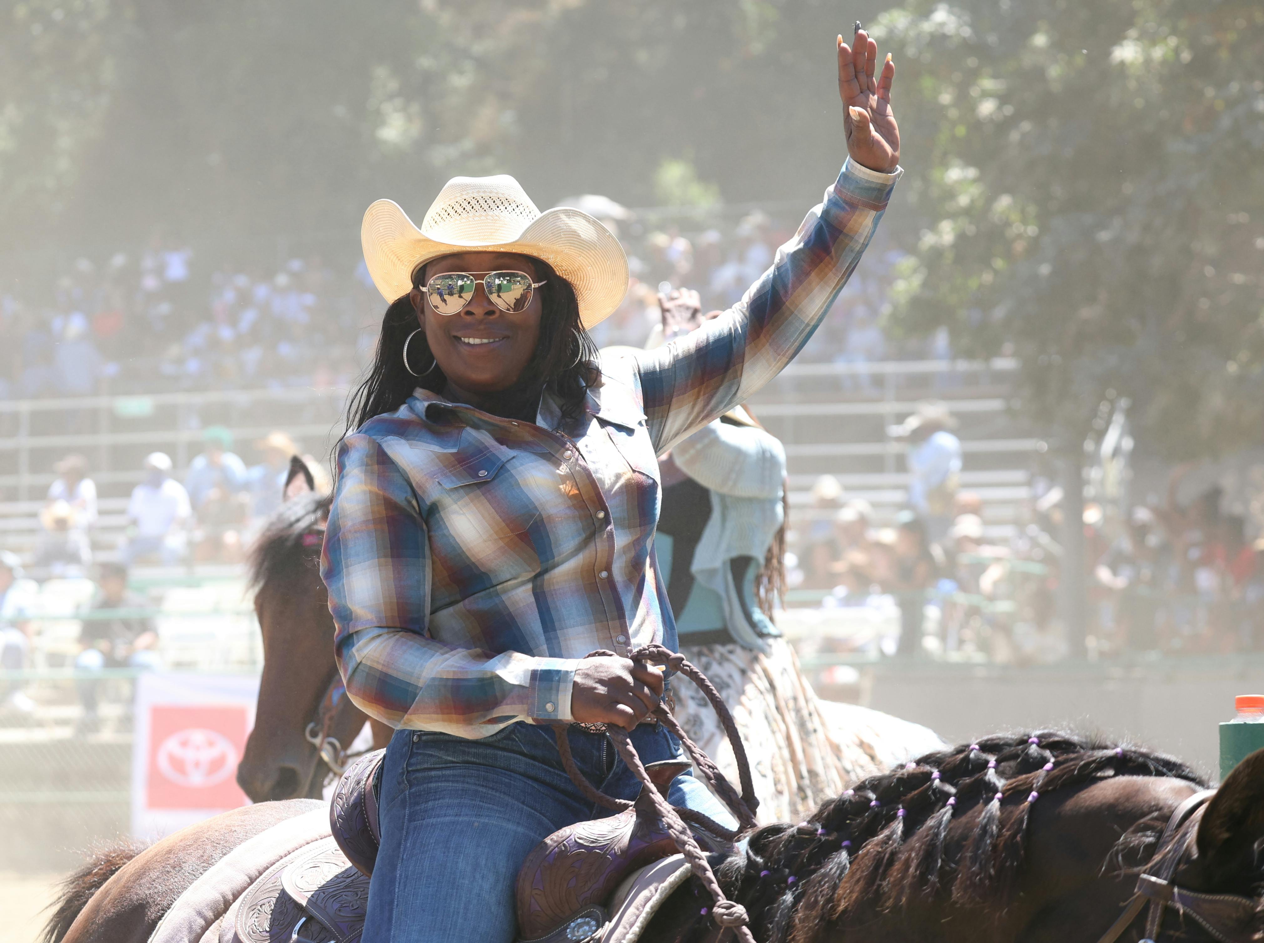 Woman in Sunglasses and Cowboy Hat riding a Horse · Free Stock Photo