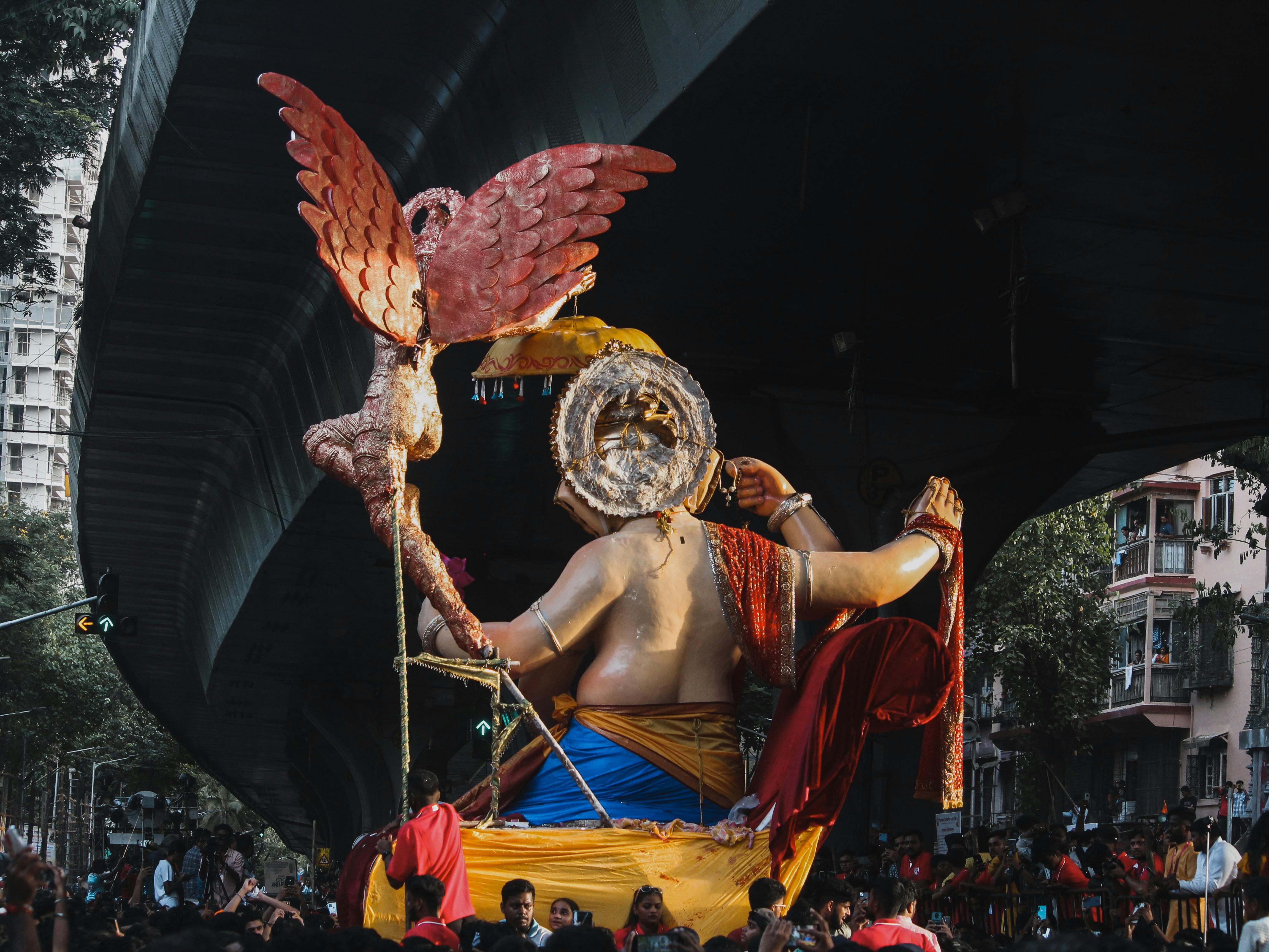 Statue of God on Street during Celebration · Free Stock Photo