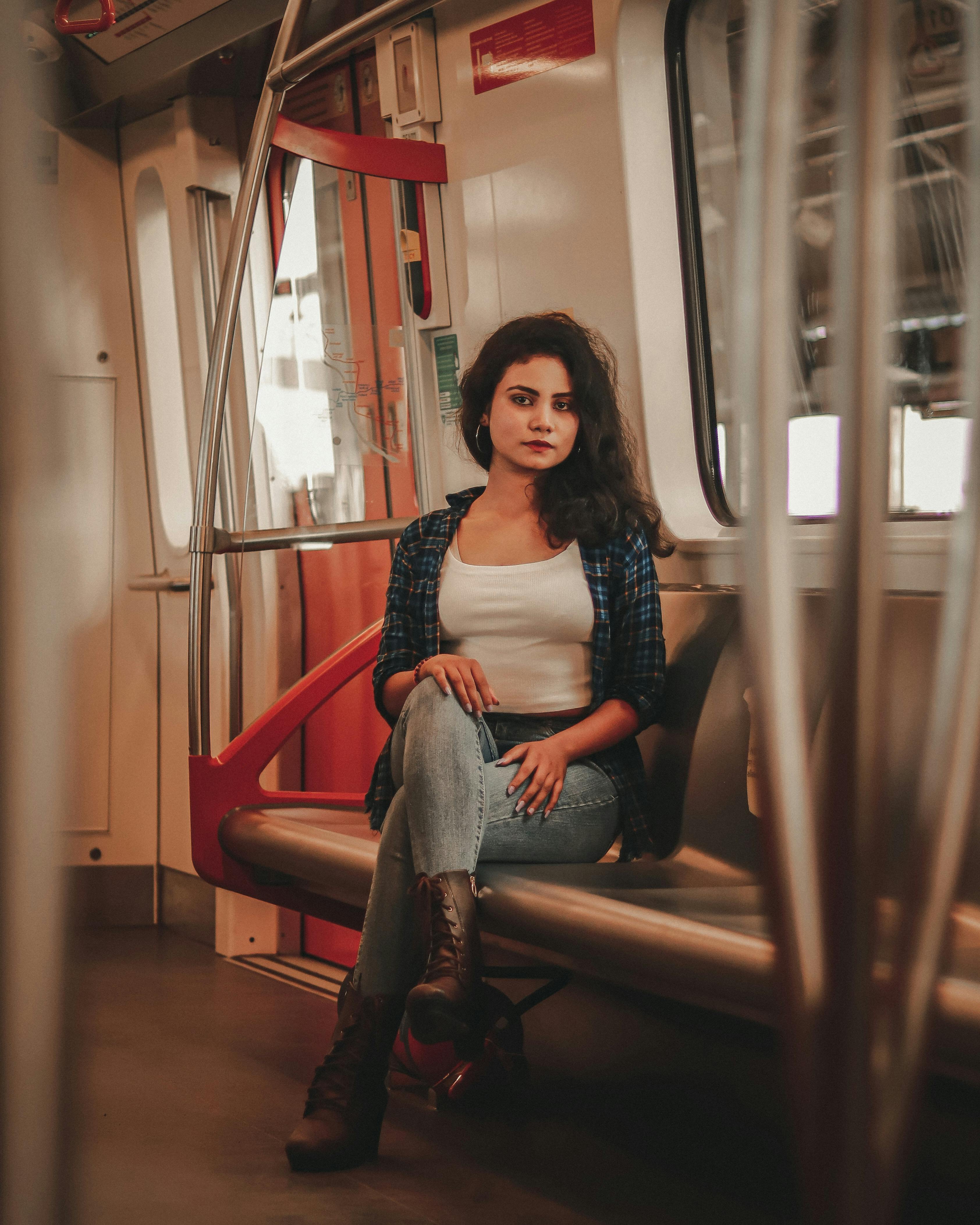 Young Woman Travelling on a Train · Free Stock Photo