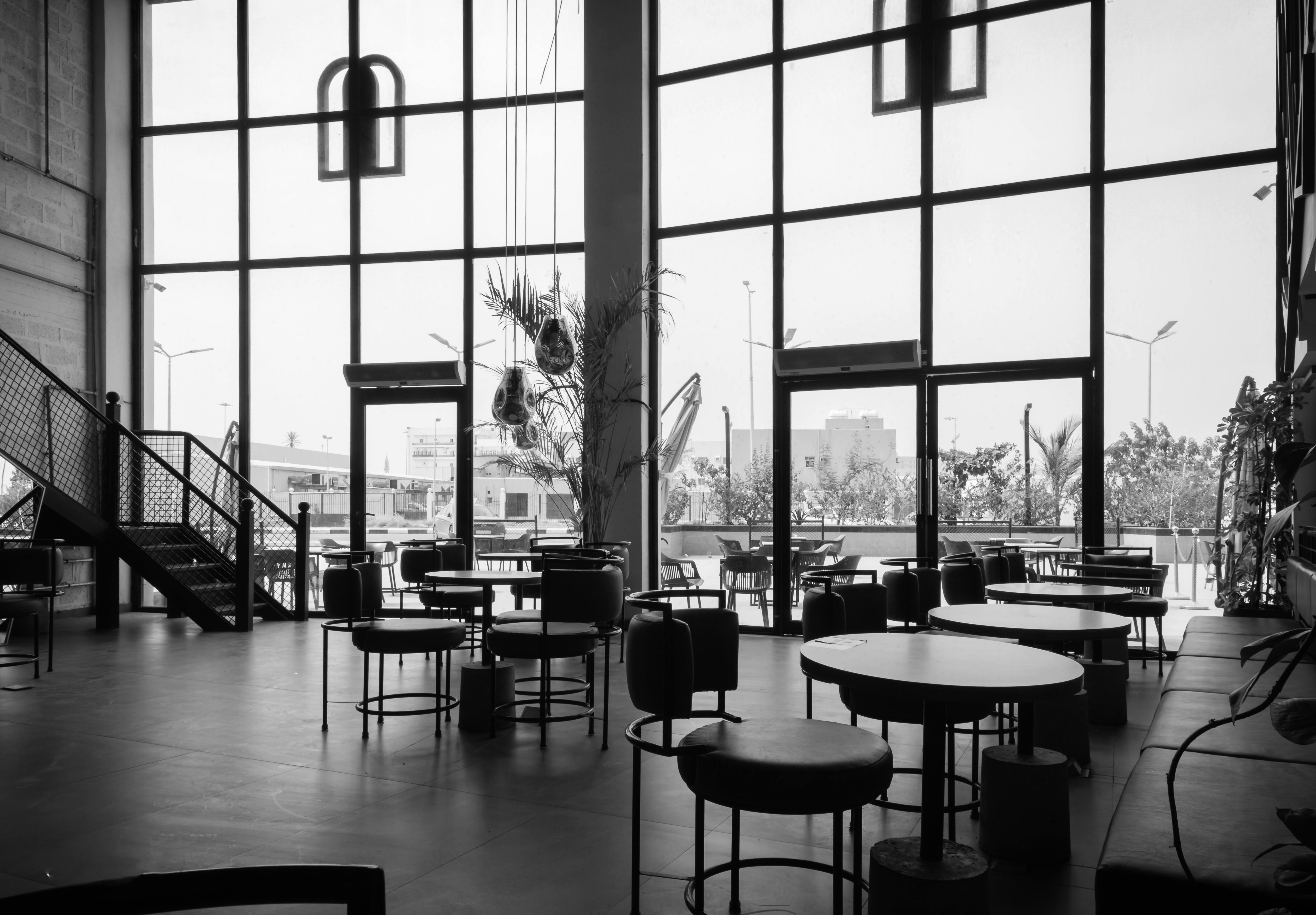 Grayscale Photography Of Inside A Coffee Shop · Free Stock Photo