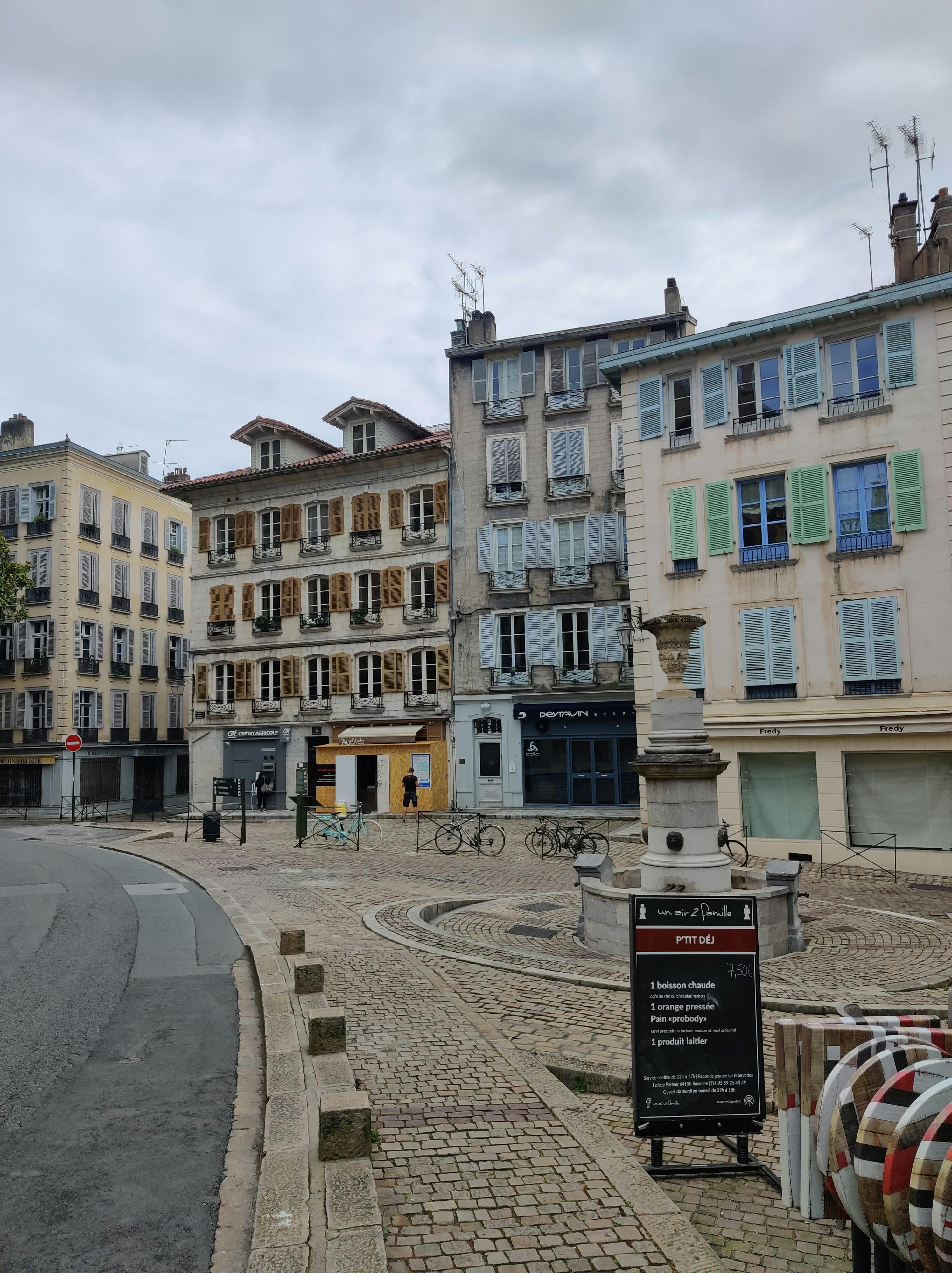 Concrete Buildings with Wooden Window Shutters · Free Stock Photo