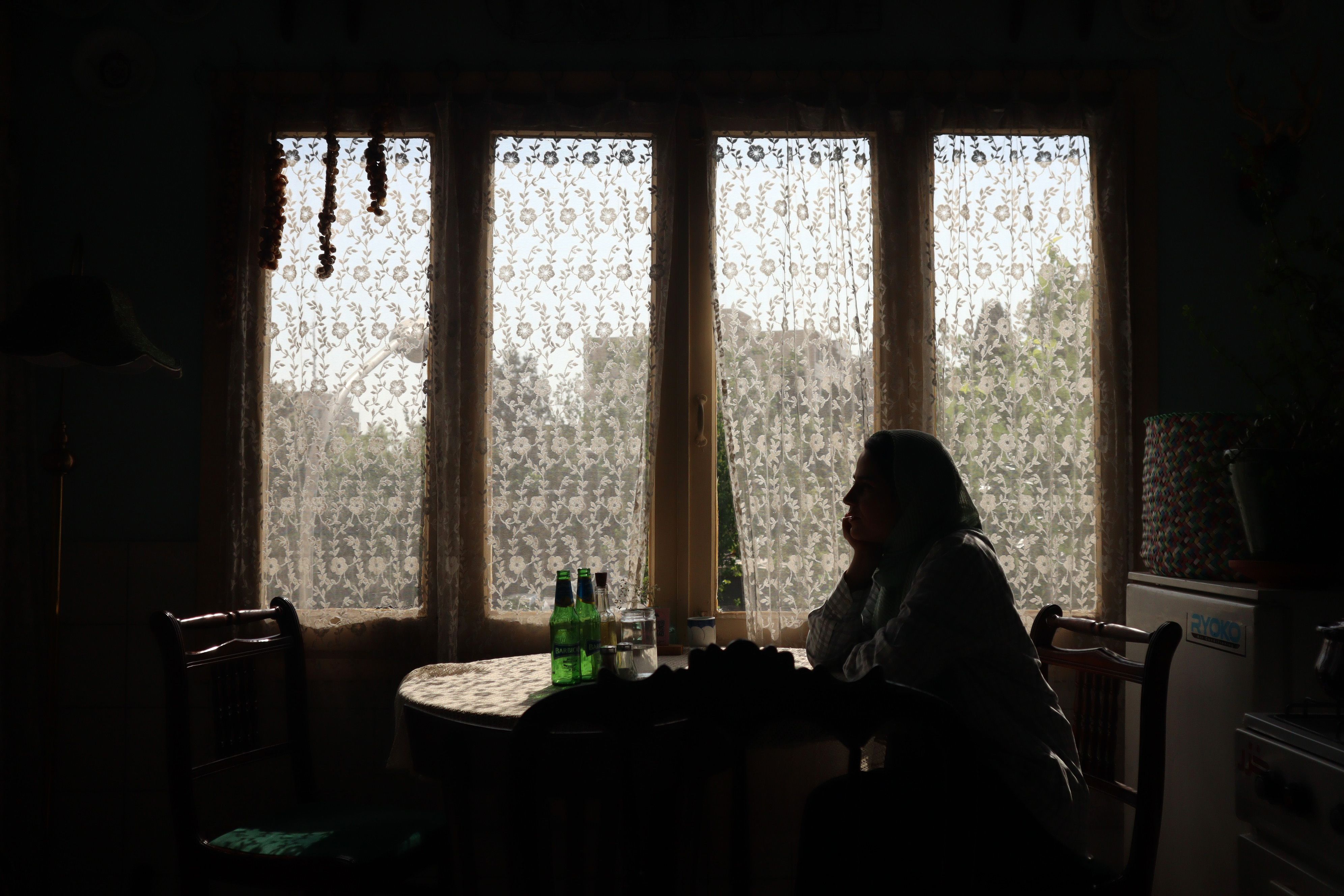 Person Sitting Near the Window · Free Stock Photo